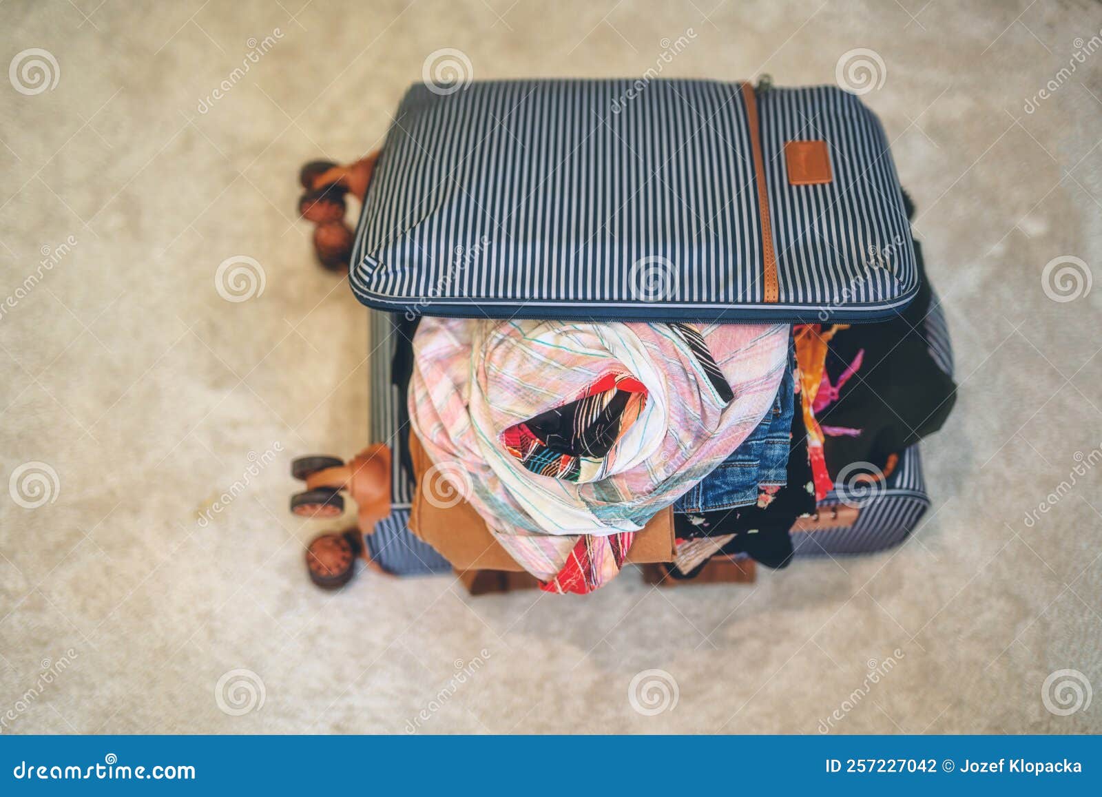 Open Suitcase Full of Clothes in Room. Stock Photo - Image of ...