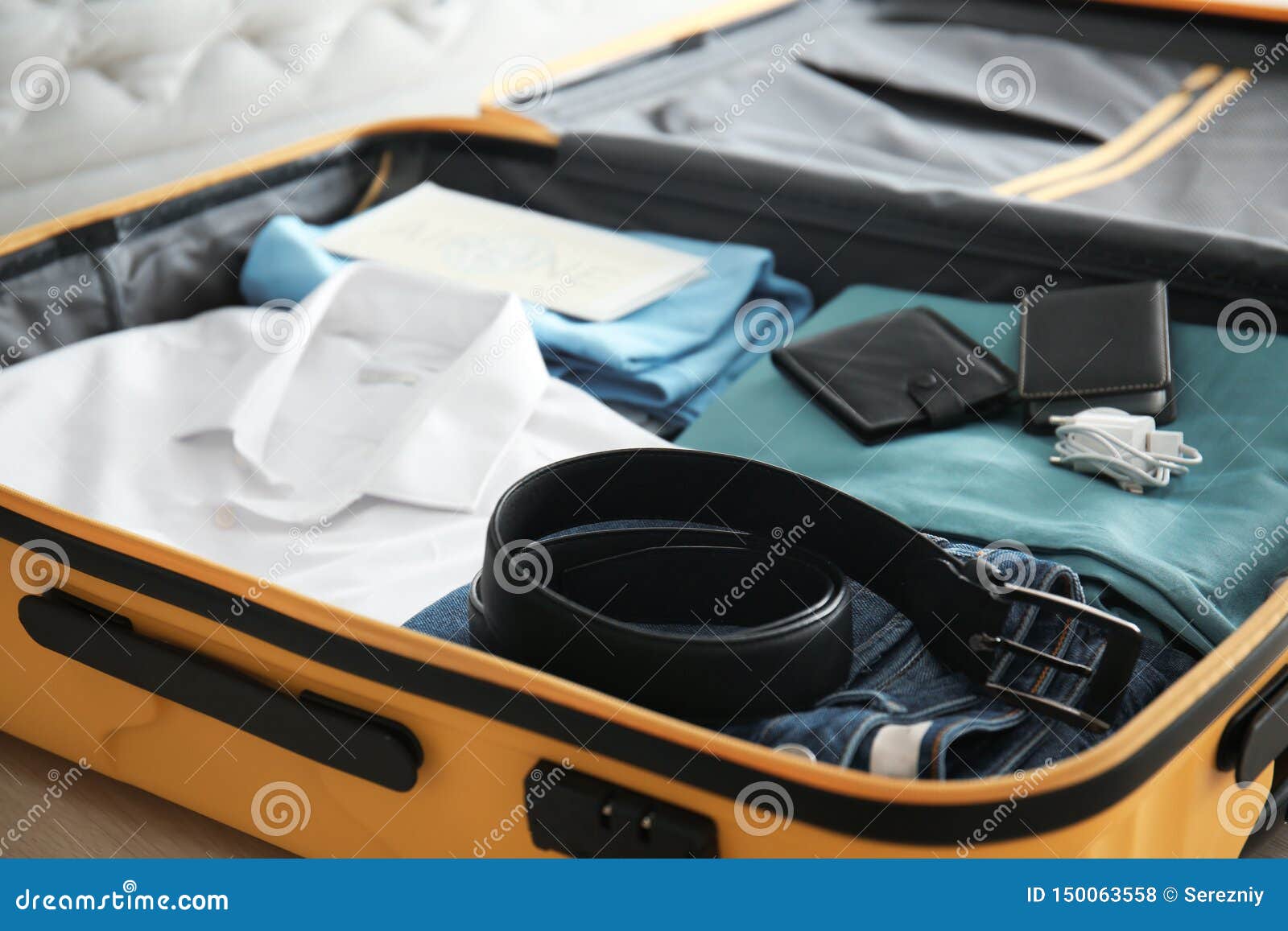 Open Suitcase with Packed Things, Closeup Stock Photo - Image of ...