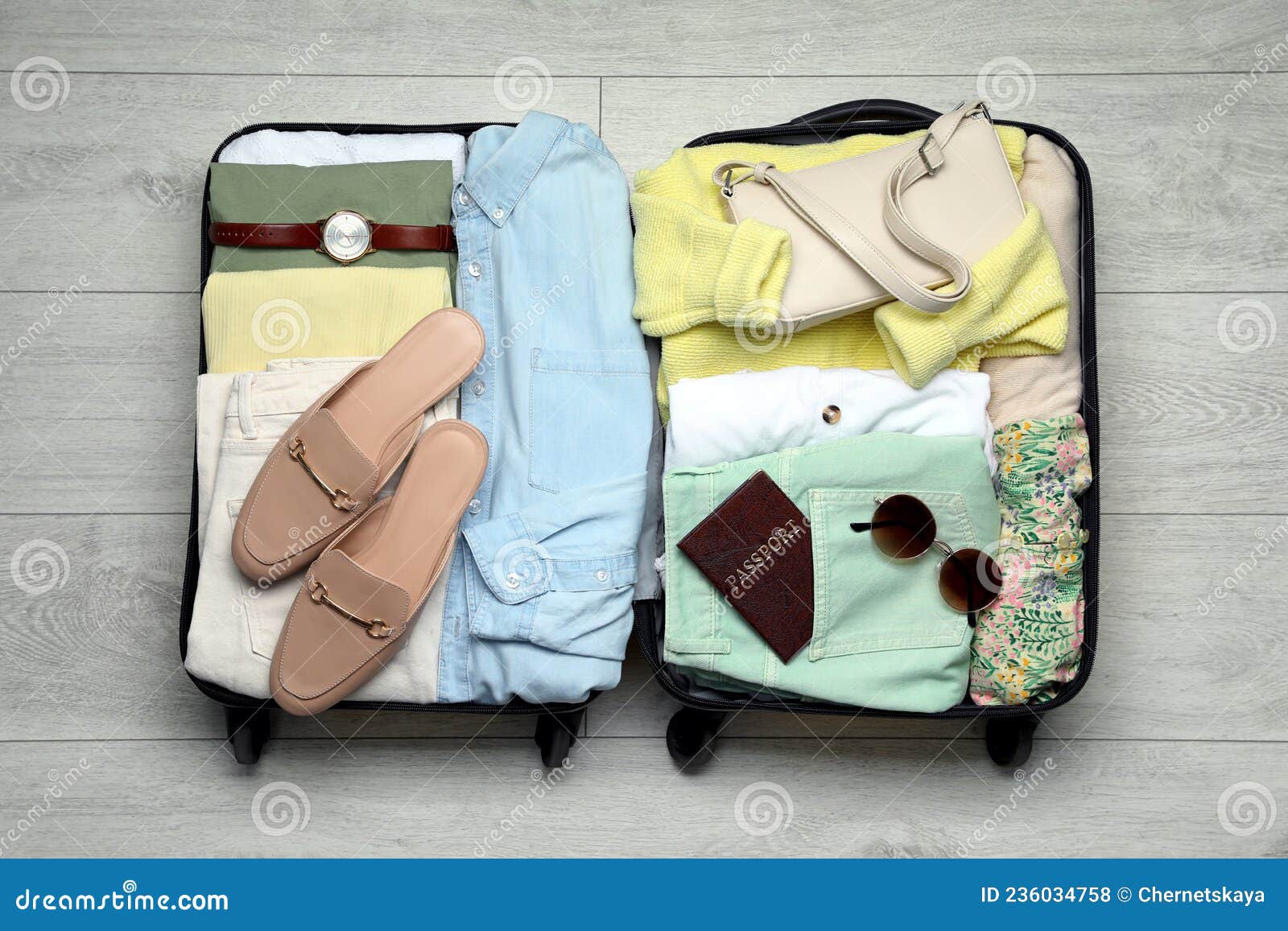 Open Suitcase Packed for Trip on Floor, Top View Stock Photo - Image of ...