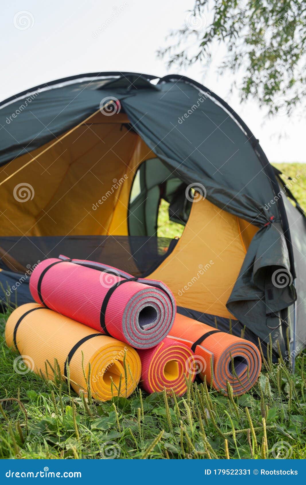 Open Tent and Rolled Sleeping Pads Stock Image - Image of open, halt ...