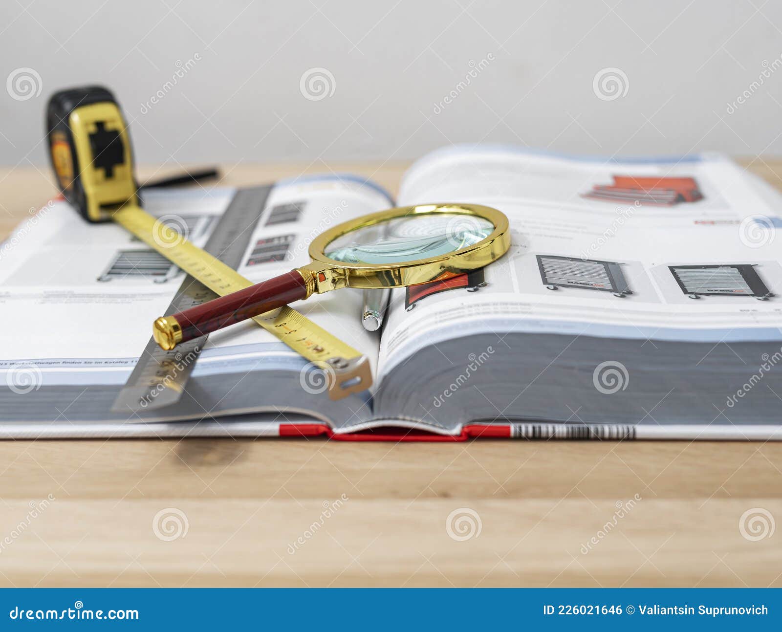 Open Thick Technical Book for Engineers with Magnifying Glass Stock ...