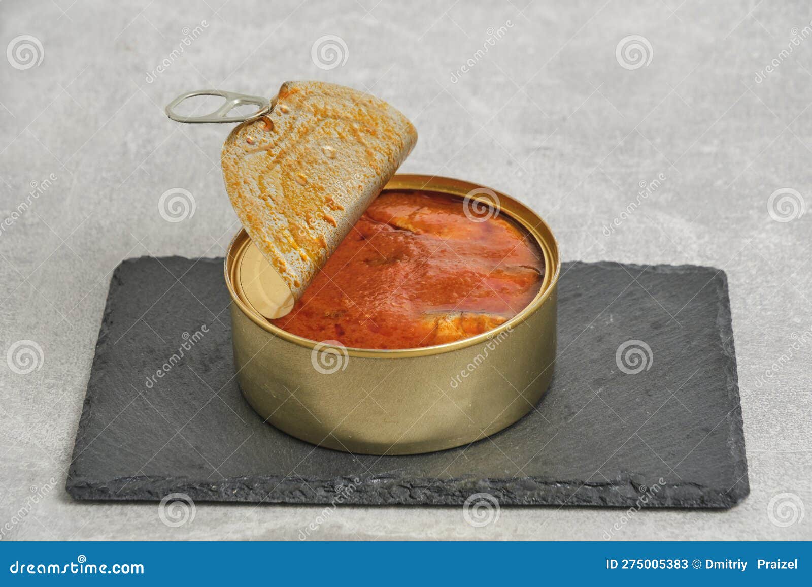 Open Tin Can with Fish in Tomato on Gray Concrete Background. Stock ...