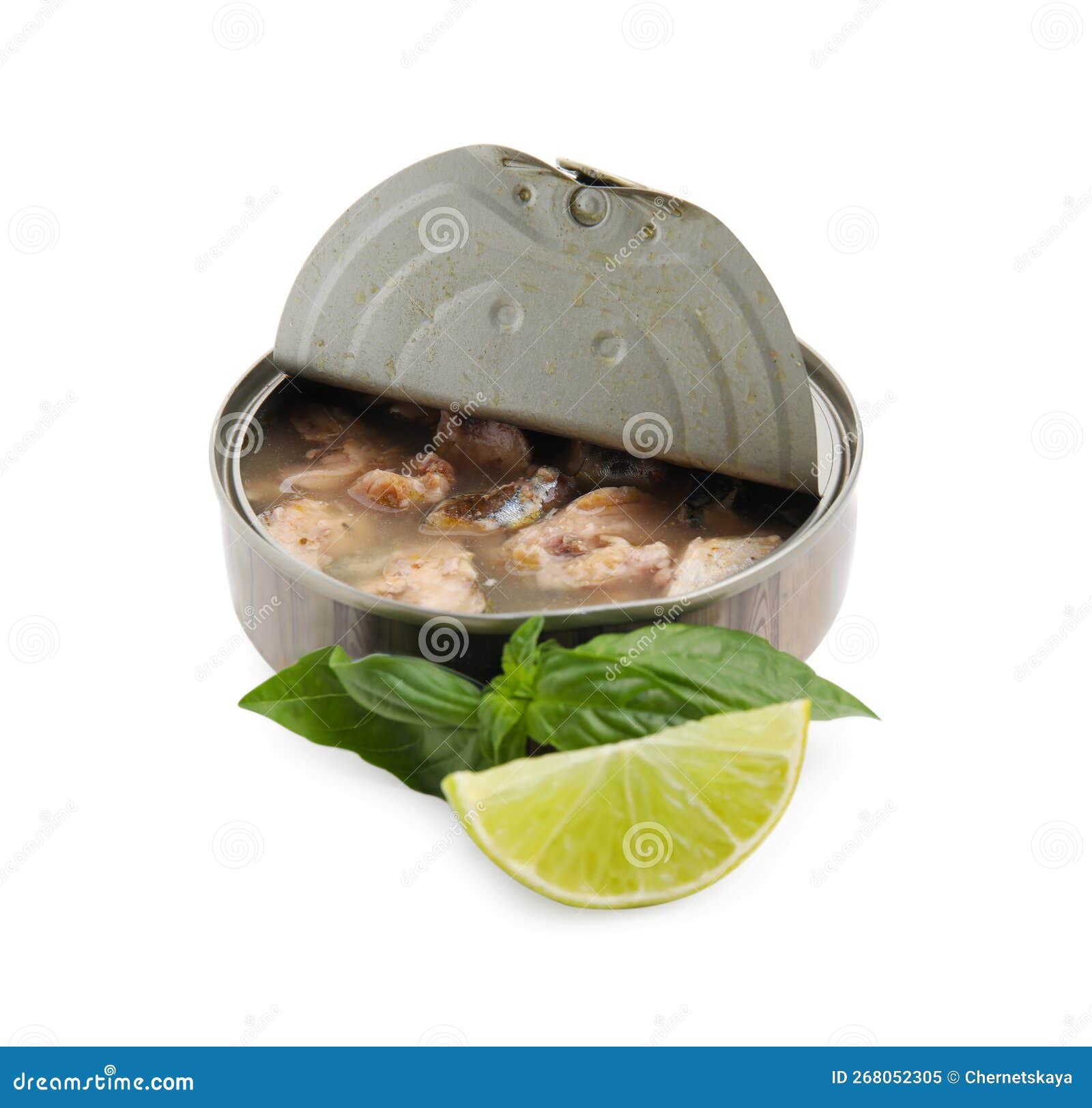 Open Tin Can with Mackerel Chunks, Lime and Basil on White Background ...