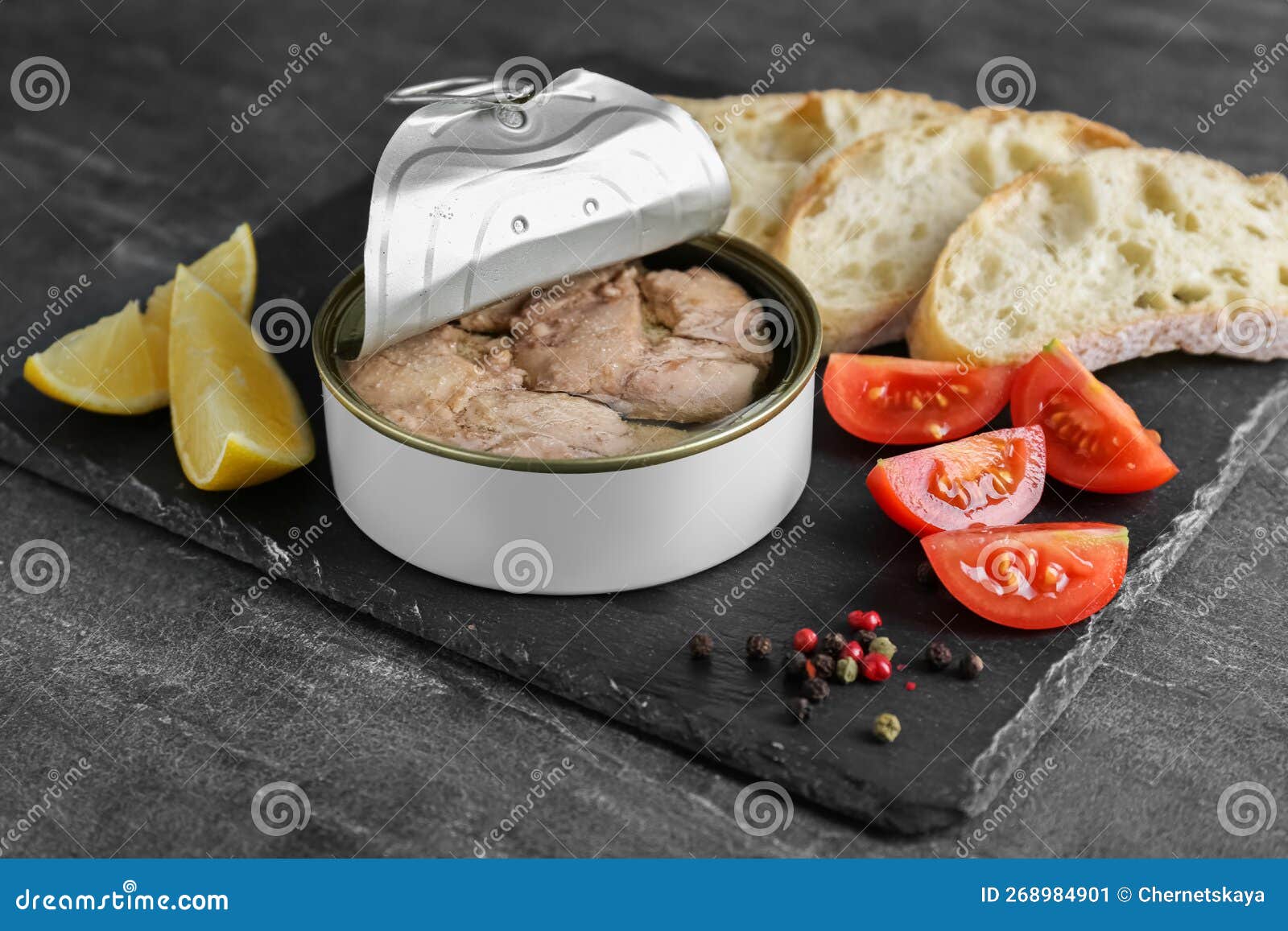Open Tin Can of Tasty Cod Liver and Different Products on Black Table ...