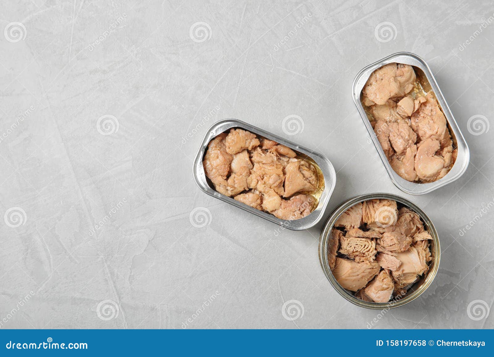 Open Tin Cans with Tuna and Cod Liver on Grey Table, Flat Lay Stock ...
