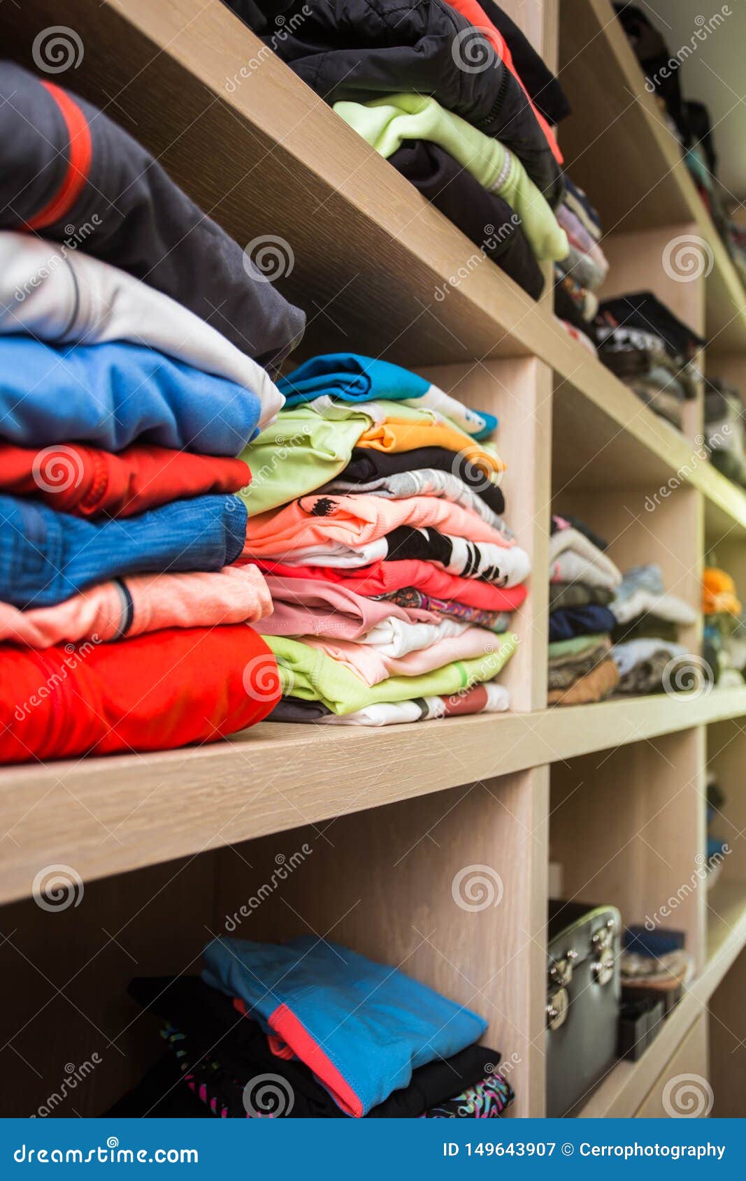 Open Wardrobe with Lots of Folded Clothes Stock Image - Image of ...