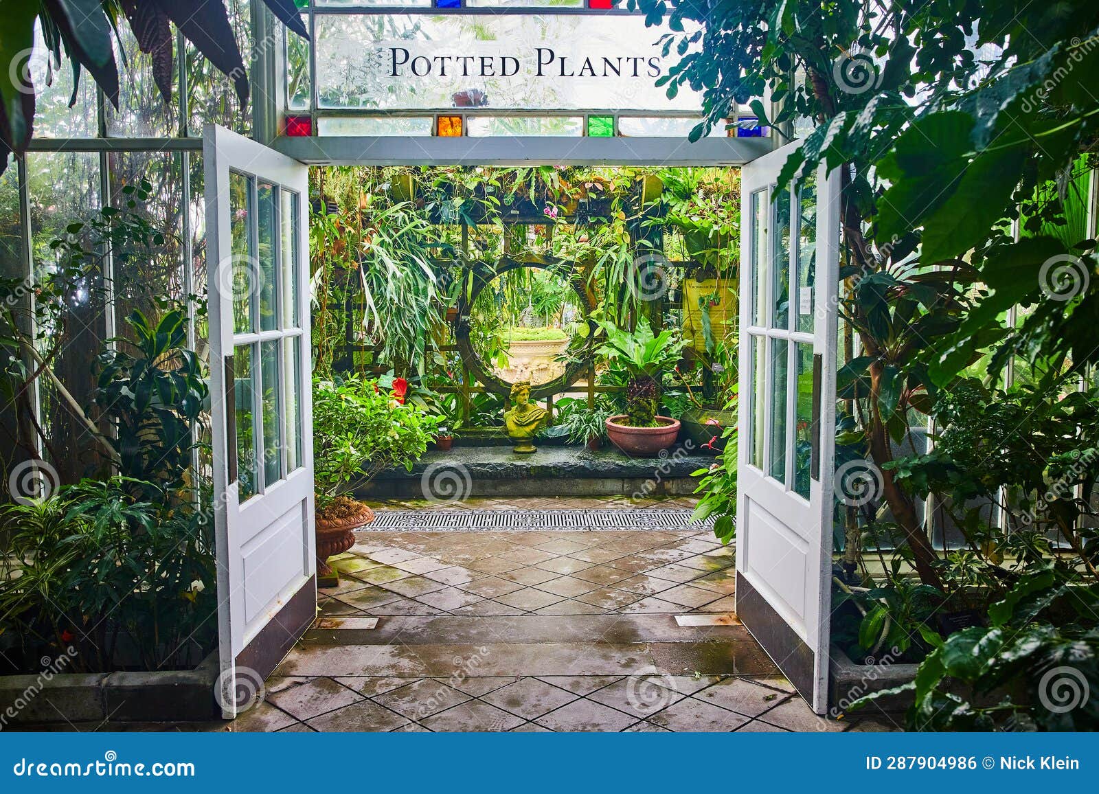 Open White Doors Leading To Potted Plants Section with Moon Gate Inside ...