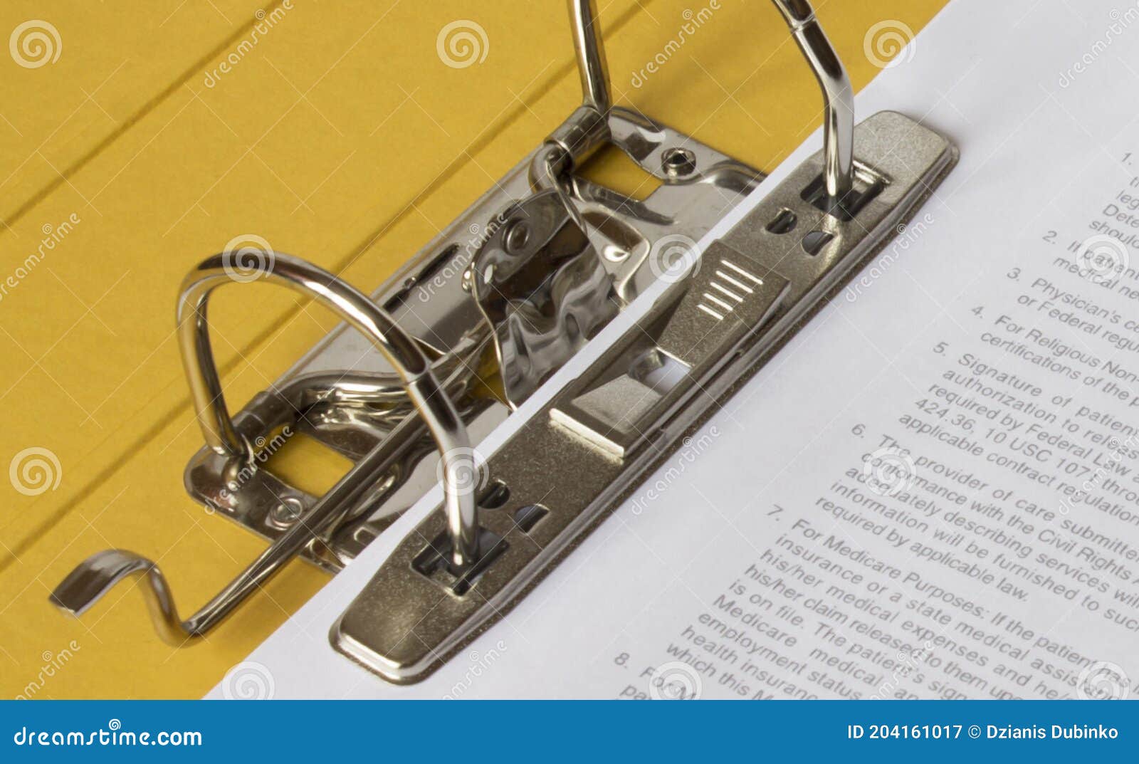 Open Yellow Binder Close Up, Stack of White Papers and Bright Metal ...