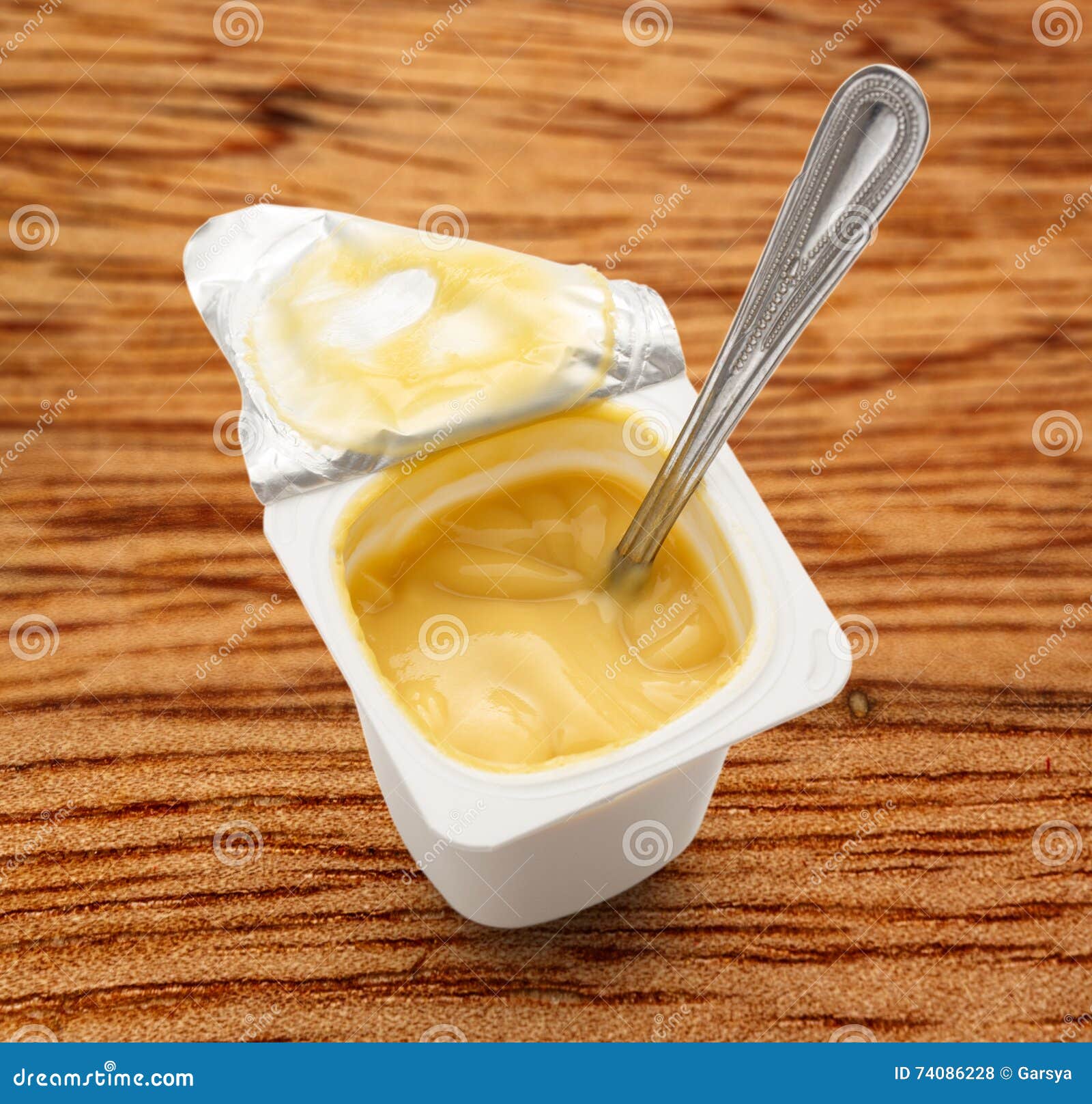 Open Yogurt in Pot with Metal Spoon Stock Photo - Image of open, small ...
