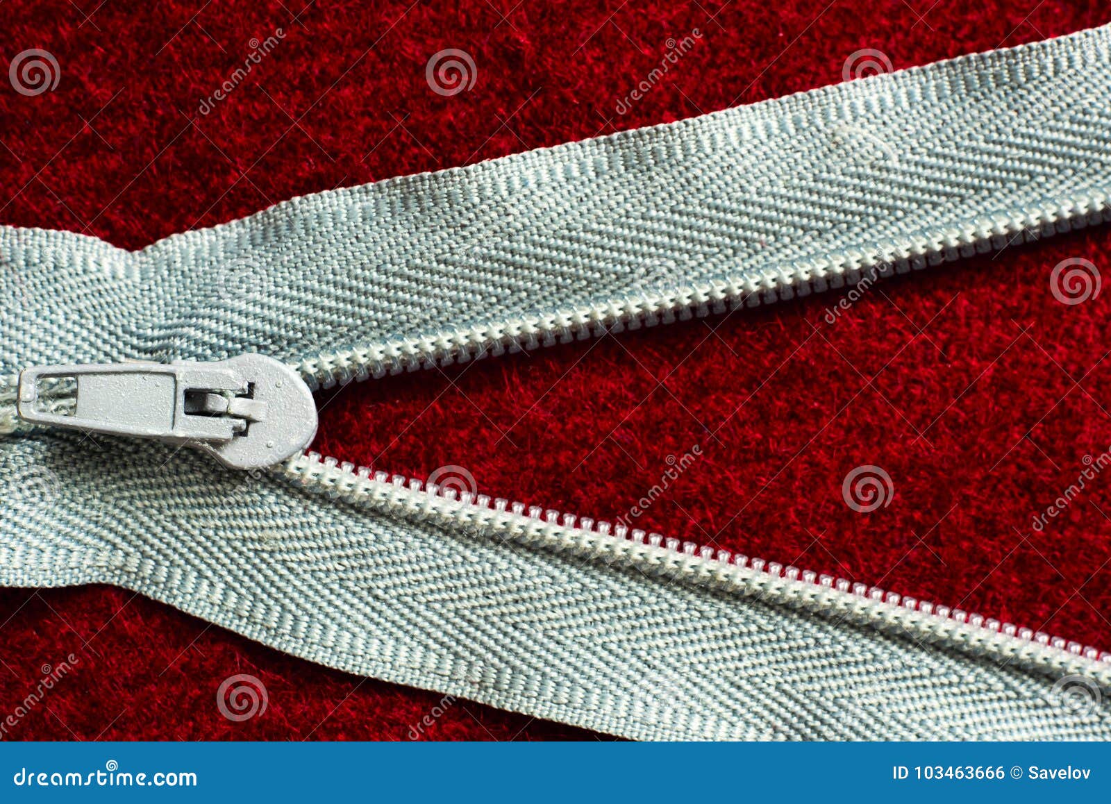 Open Zipper with a Runner on a Red Cloth Stock Photo - Image of macro ...