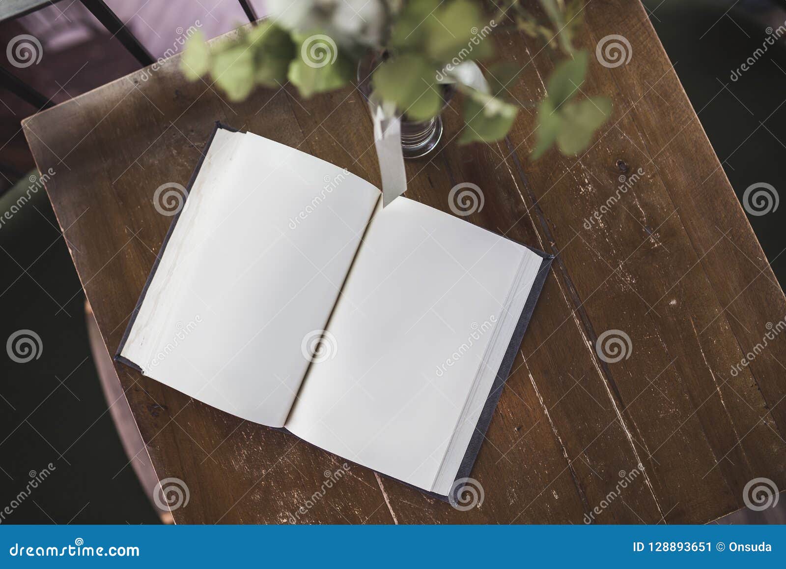 Opened blank book on table stock image. Image of note - 128893651