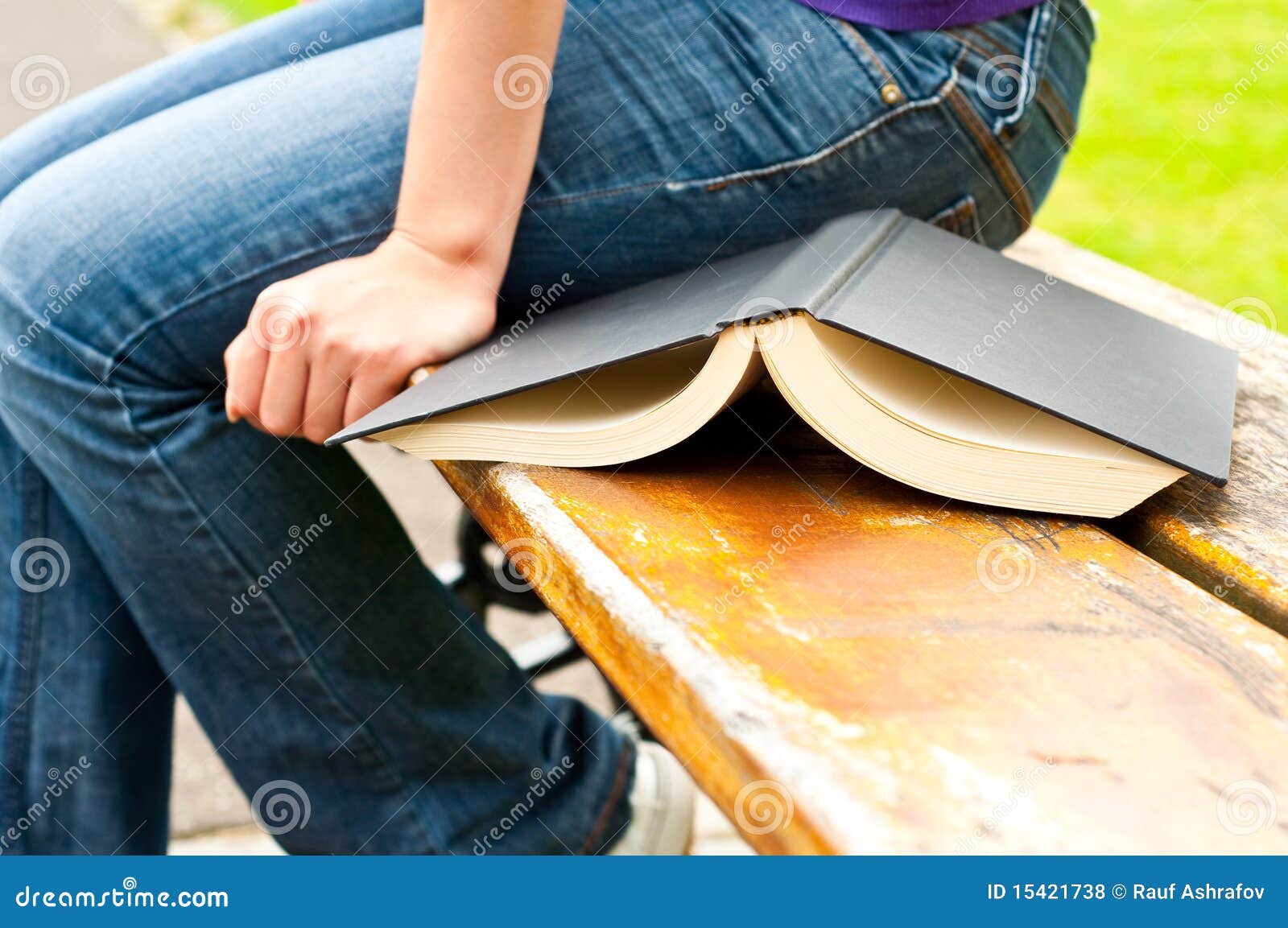 Opened Book Next To a Woman Sitting on a Bench Stock Photo - Image of ...