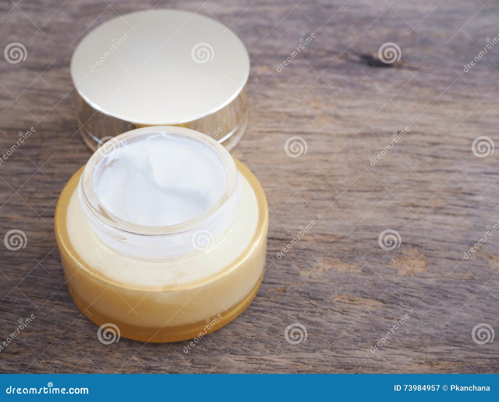 Opened Cream Container and Cap Stock Image - Image of wooden, silver ...