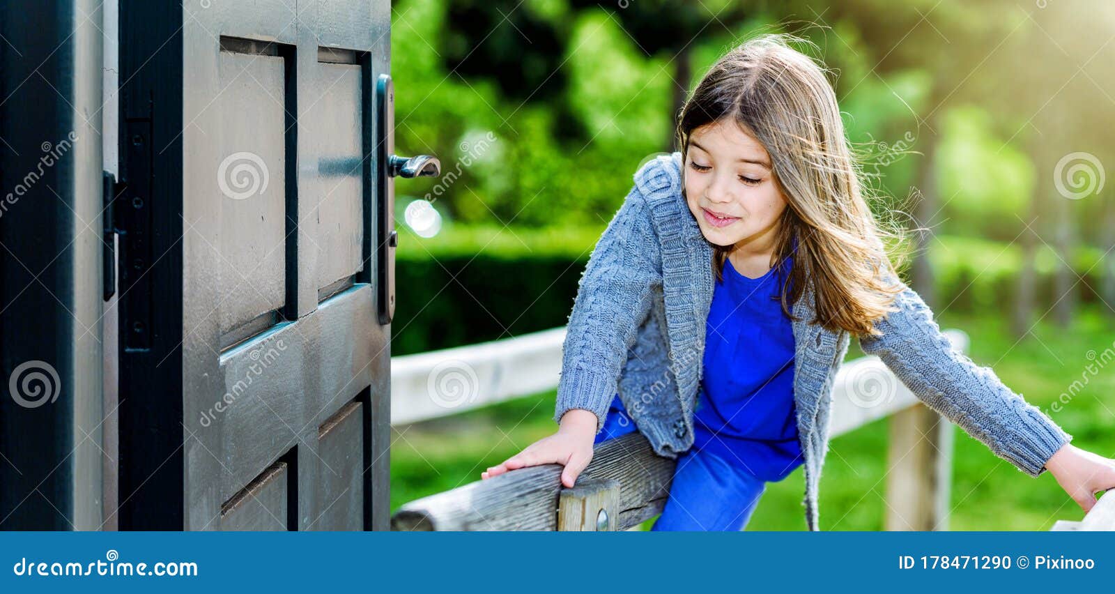 Opened Door Concept with a Young Child Playing in a Playground Stock ...