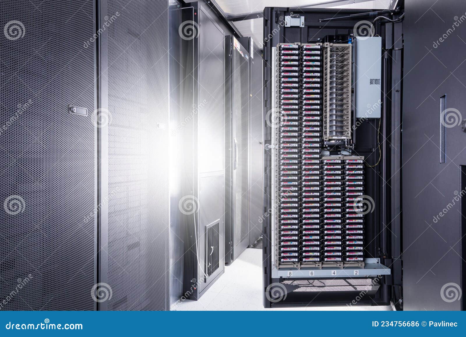 An Opened Door of Data Center Cabinet Filled with Data Storage H Stock ...