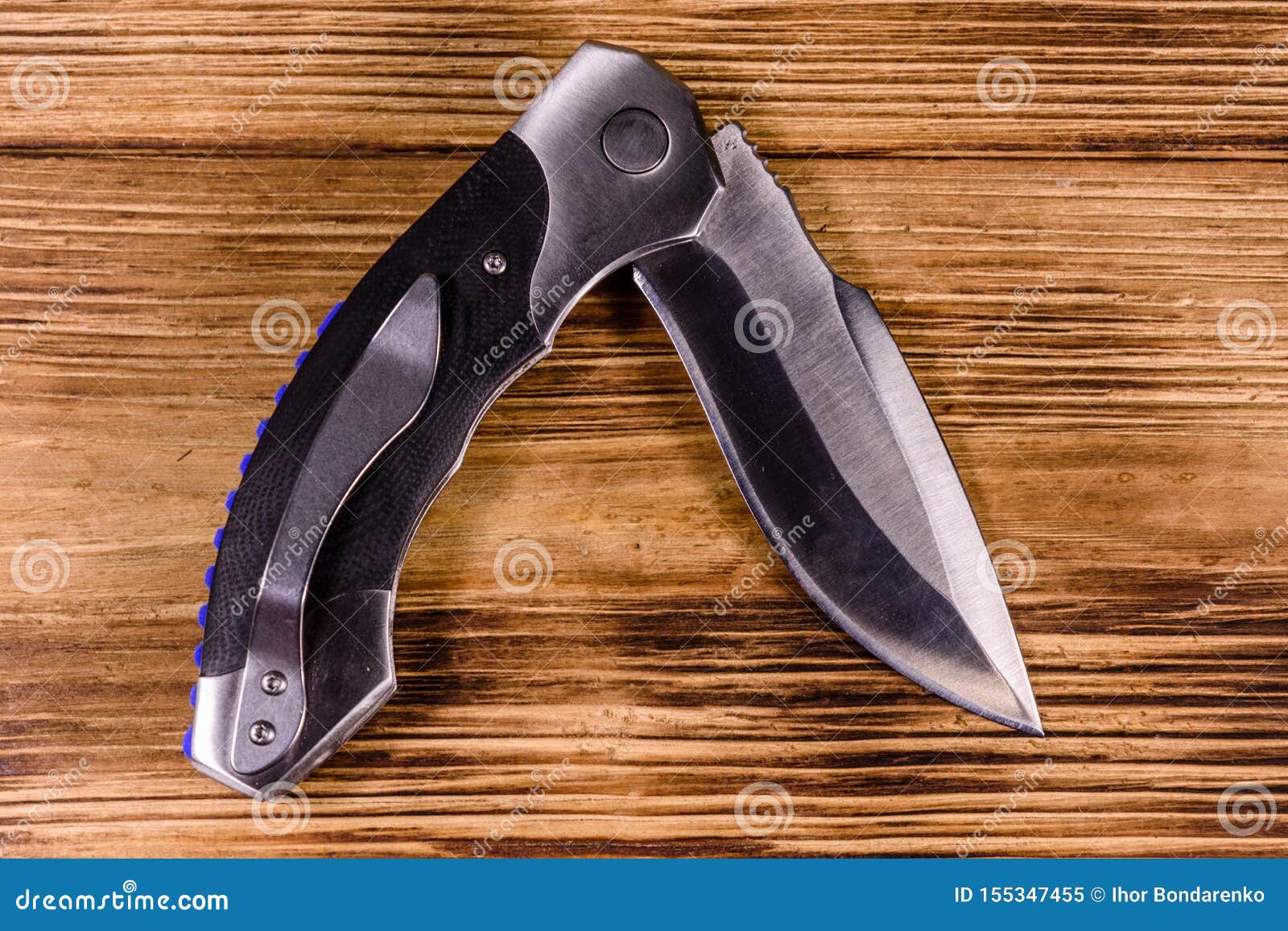 Opened Folding Knife on a Wooden Table. Top View Stock Image - Image of ...