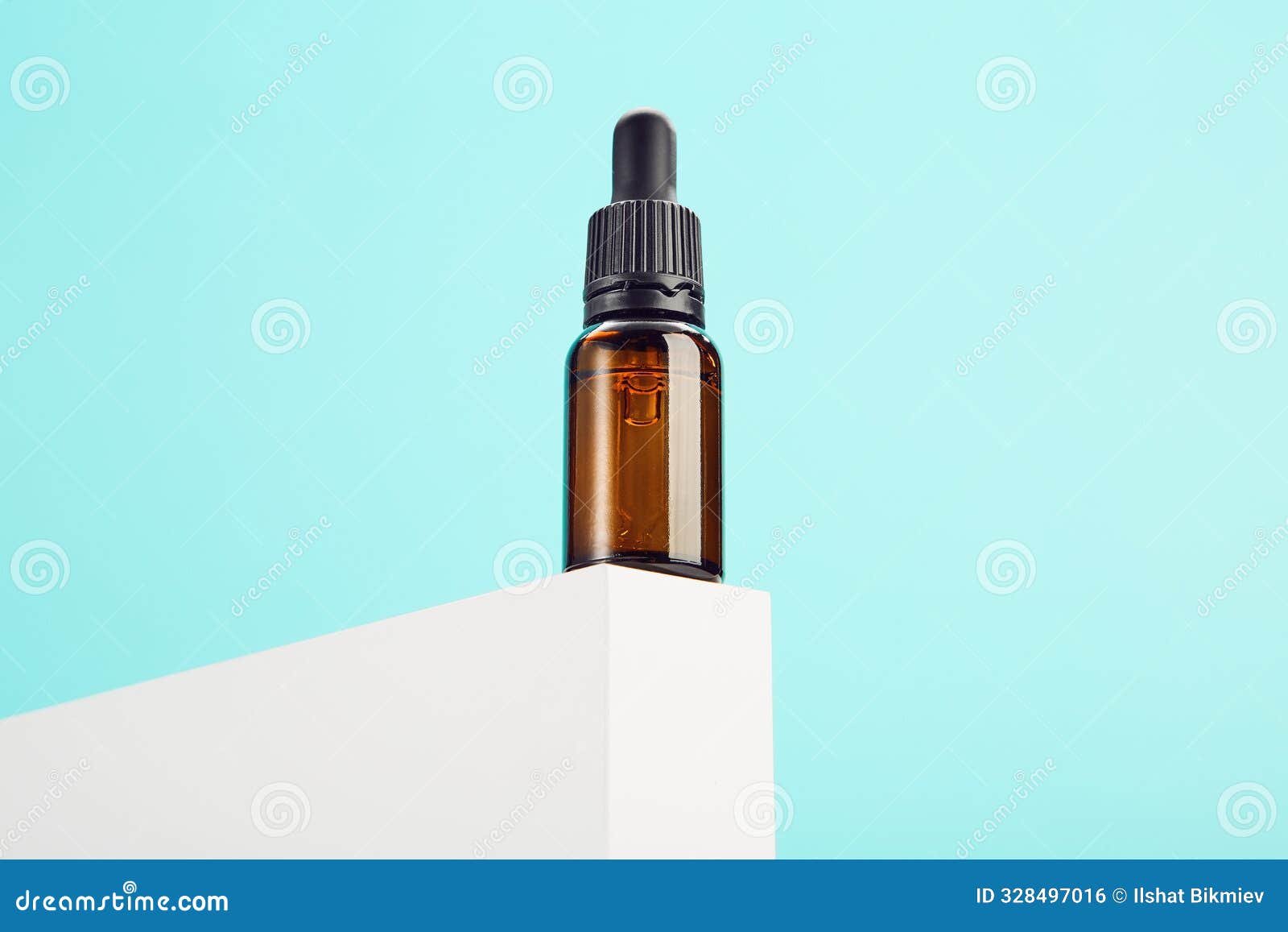 Opened Glass Dropper Container is on White Shape on Blue. Stock Photo ...