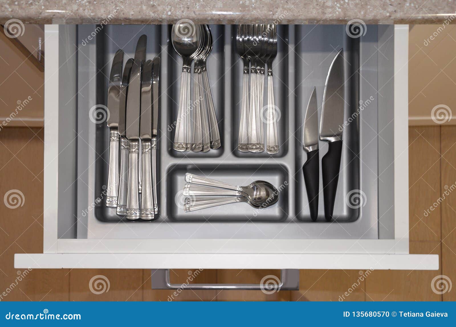 Opened Kitchen Drawer with a Tray and Cutlery Set Inside. View from ...