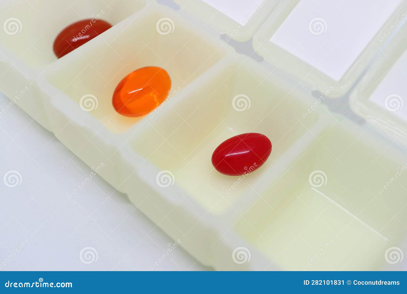 Opened daily Pill Organizer Case with Assorted Supplement Pills on ...