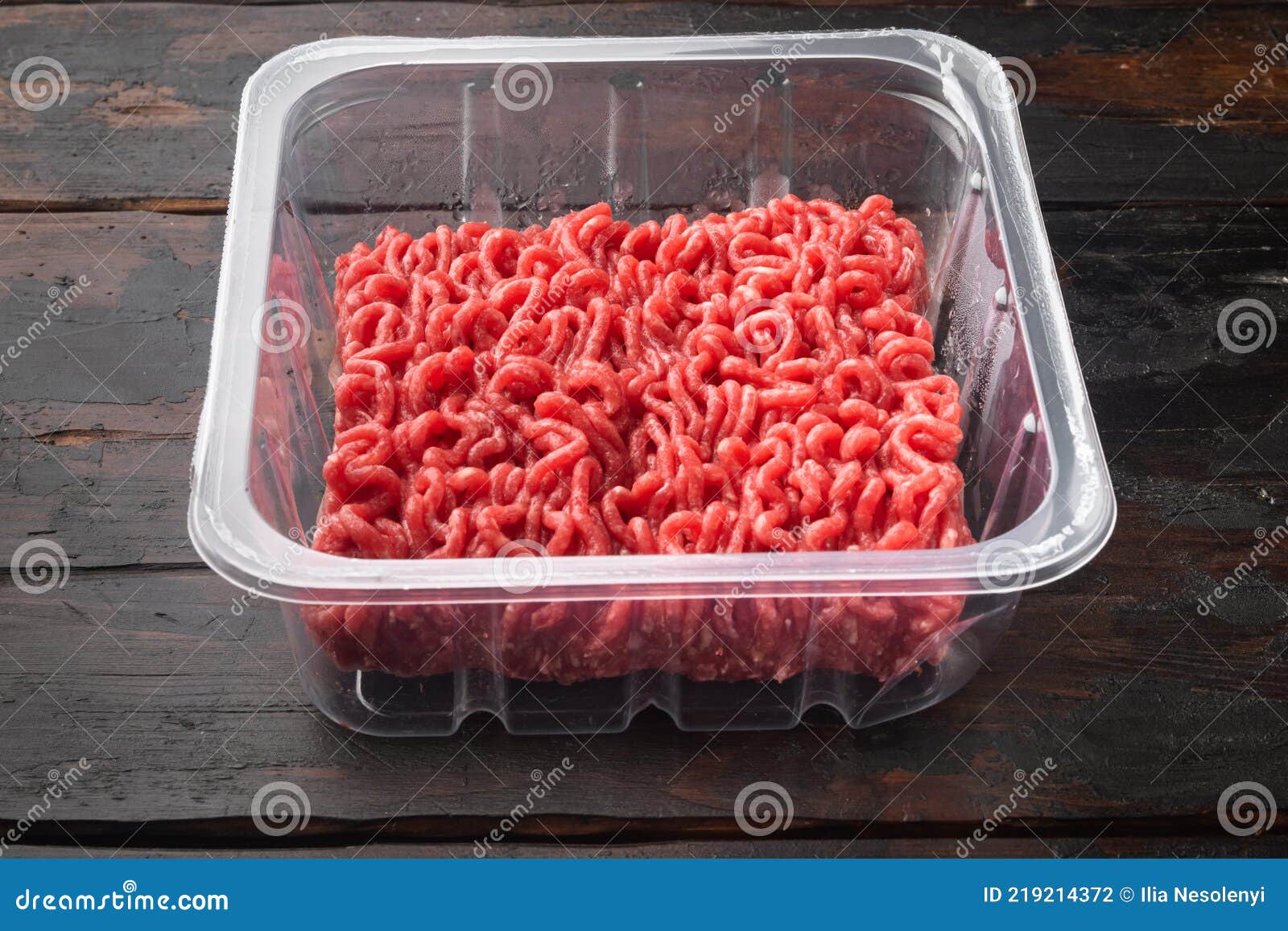 Opened Plastic Tray with Fresh Raw Minced Beef Meat, on Old Dark Wooden ...