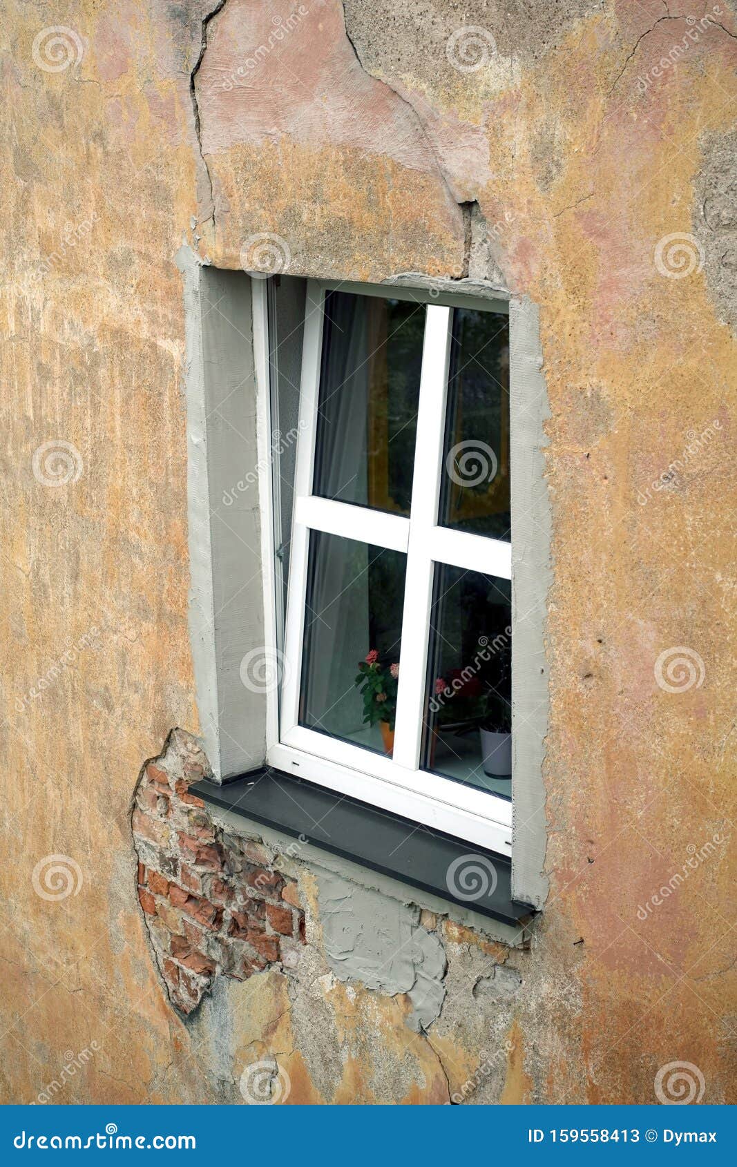 An Opened Plastic Window on Bad Condition House Wall Covered with ...