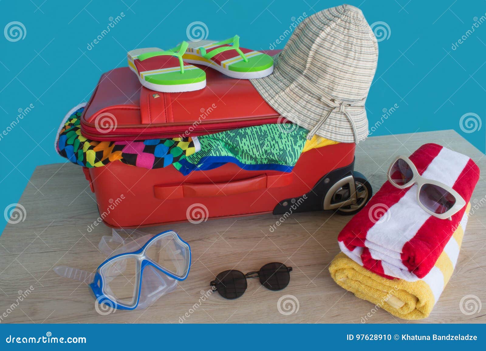 Opened Traveler Case, Suitcase on Table. Suitcase with Different Things ...