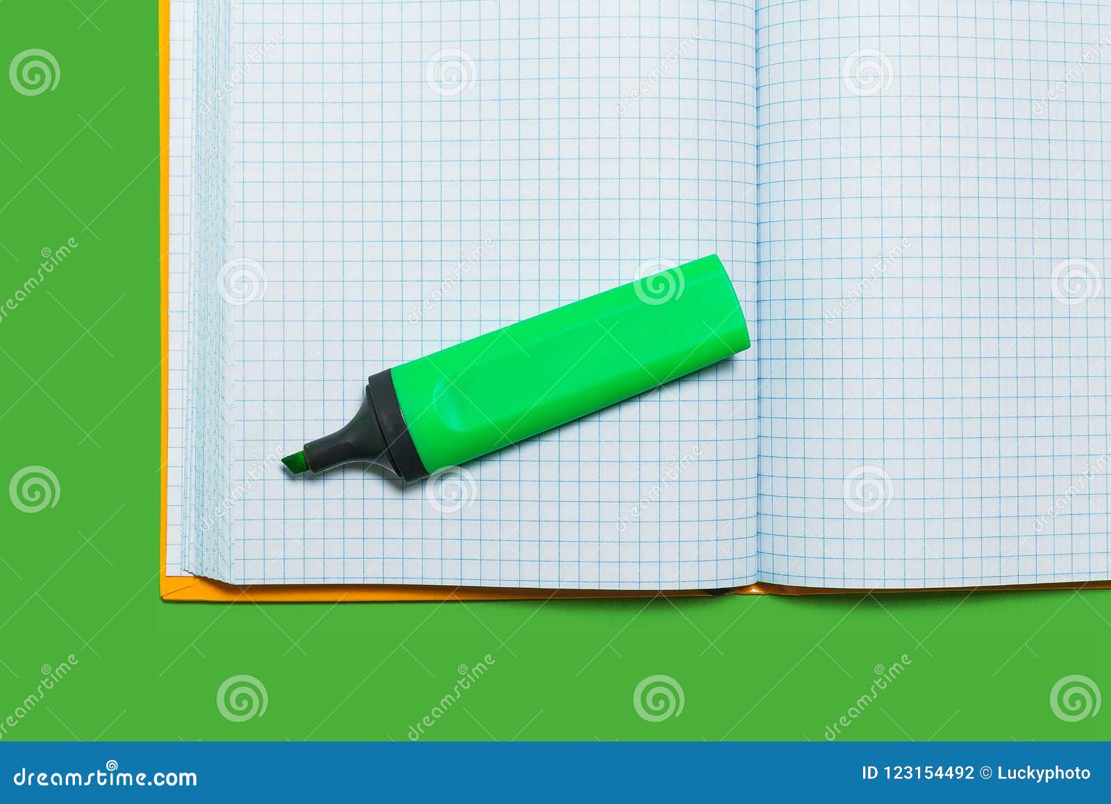 Opened Workbook and a Marker on a Green Surface Stock Photo - Image of ...