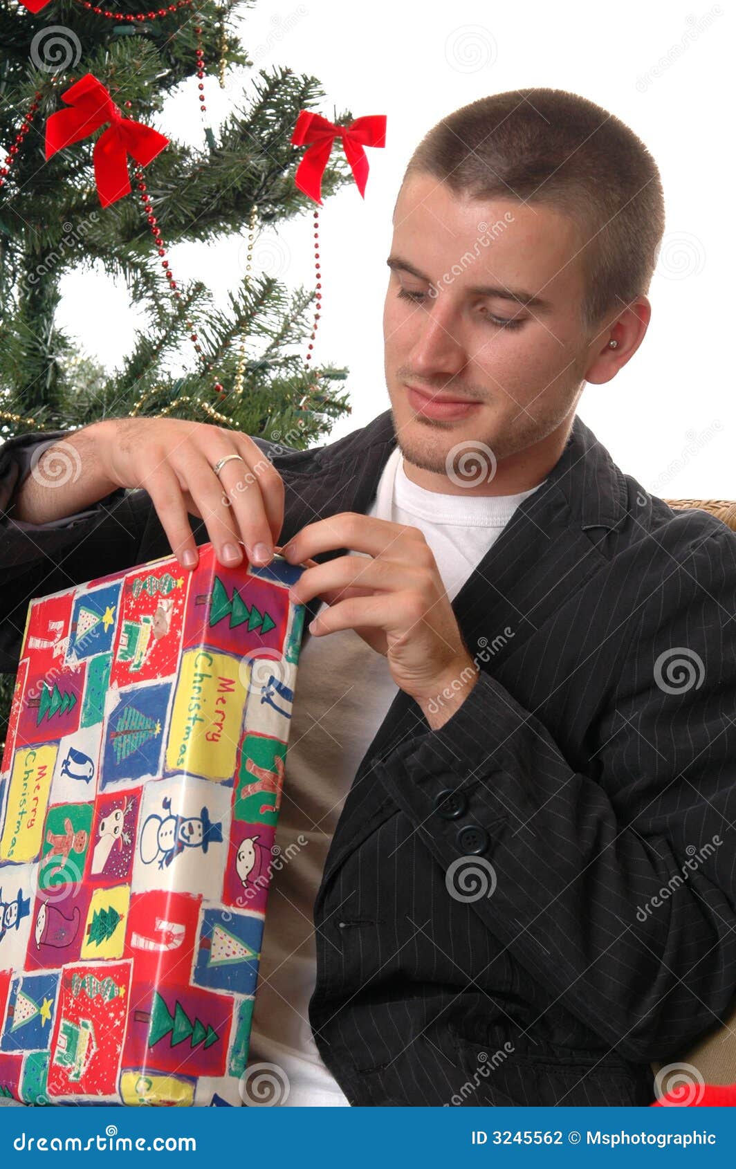 Opening Christmas Gift stock photo. Image of gift, tree - 3245562