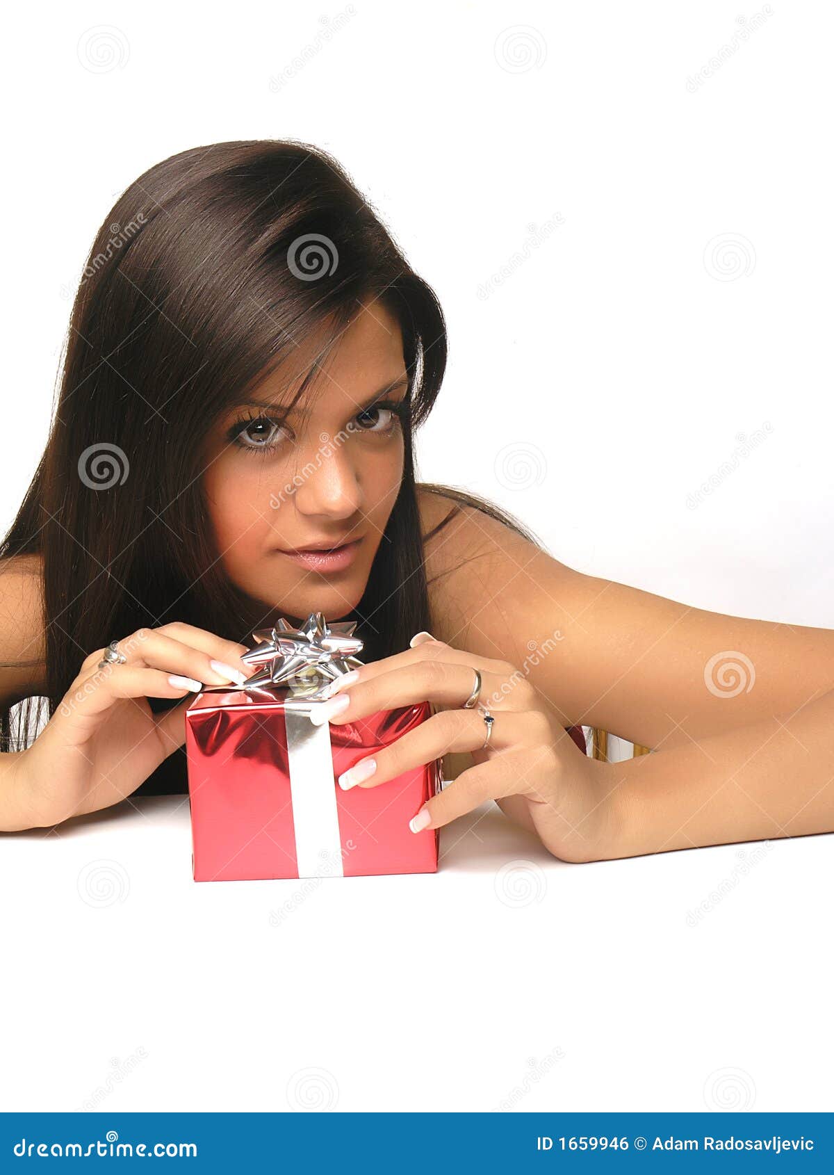 Opening a Gift stock photo. Image of flirtatious, demure - 1659946