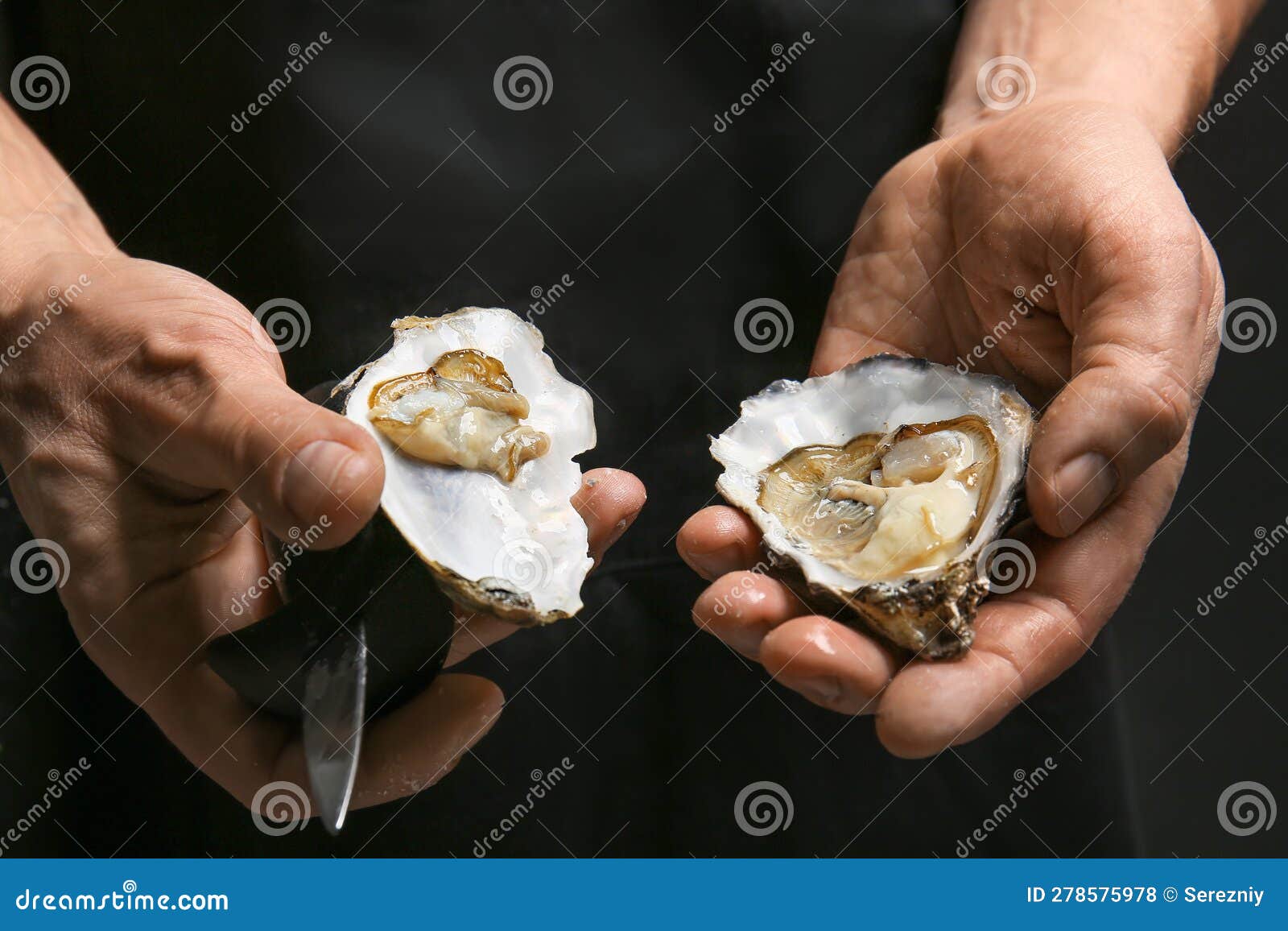 Man Opening Shell of Fresh Oyster on Dark Background Stock Photo ...