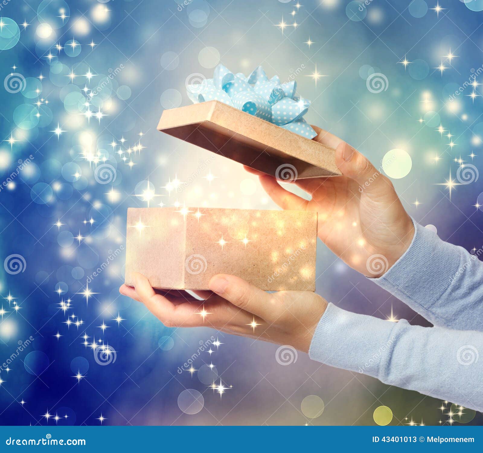 Opening a Special Gift stock image. Image of blue, giving - 43401013