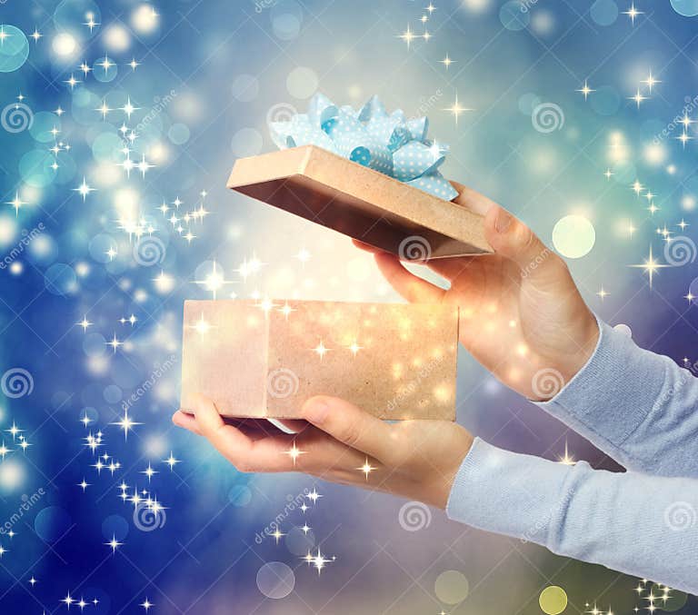 Opening a Special Gift stock image. Image of blue, giving - 43401013