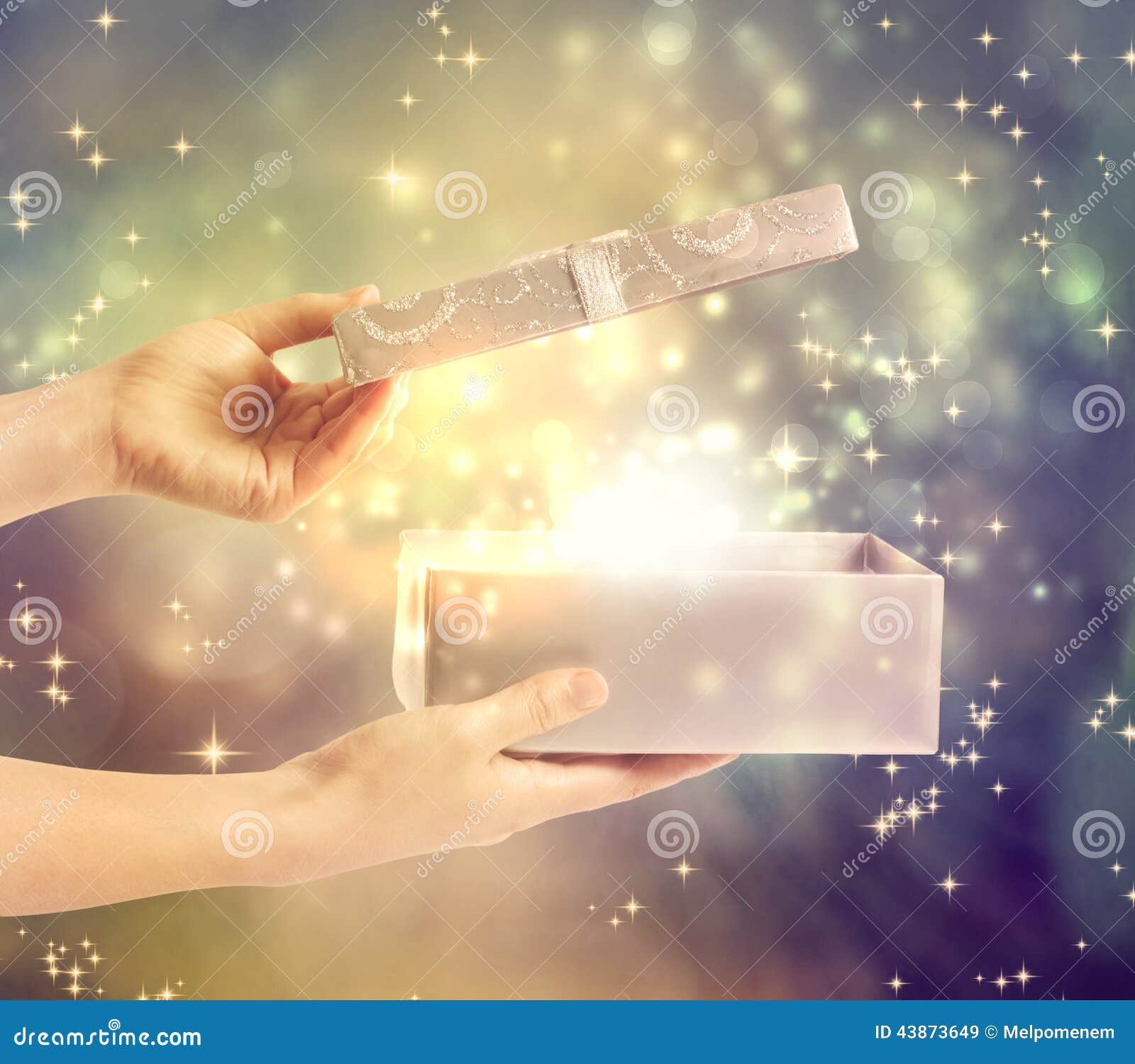 Opening a Special Gift stock image. Image of light, hand - 43873649