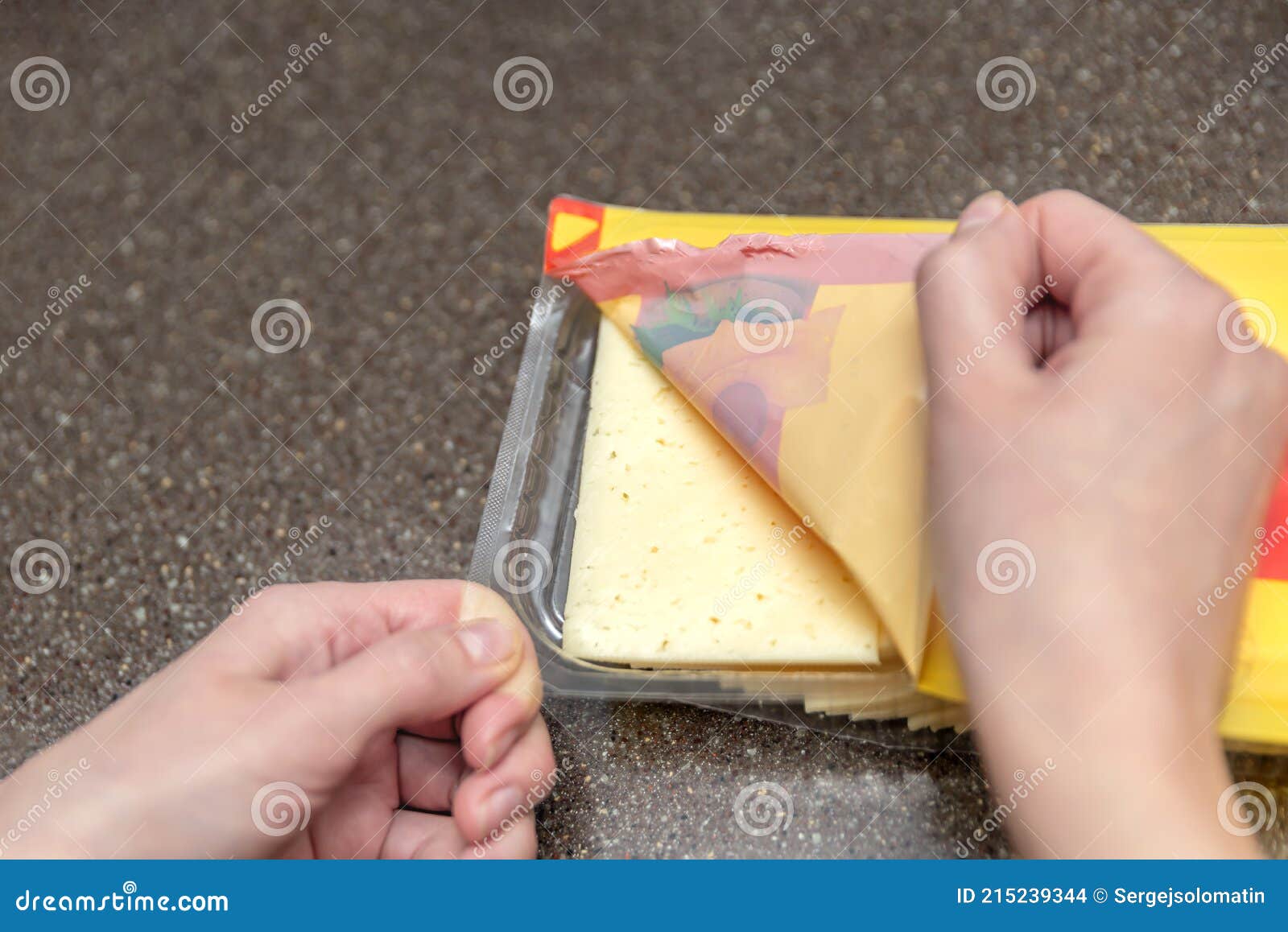 Opens a Bag of Sliced Cheese, a Woman Opens a Bag of Cheese, Pieces of ...