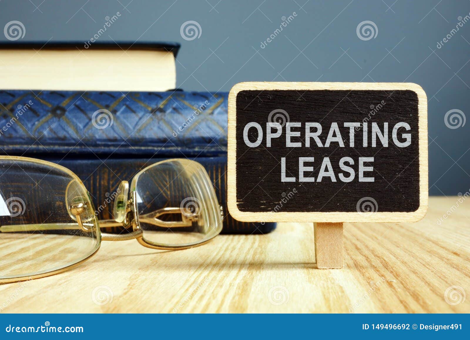 Operating Lease Concept. Nameplate and Books on Table Stock Photo ...