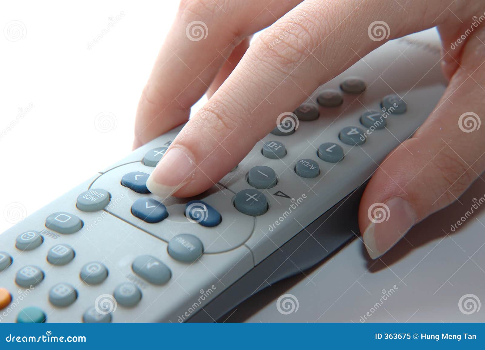 Operating a remote control stock image. Image of pretty - 363675