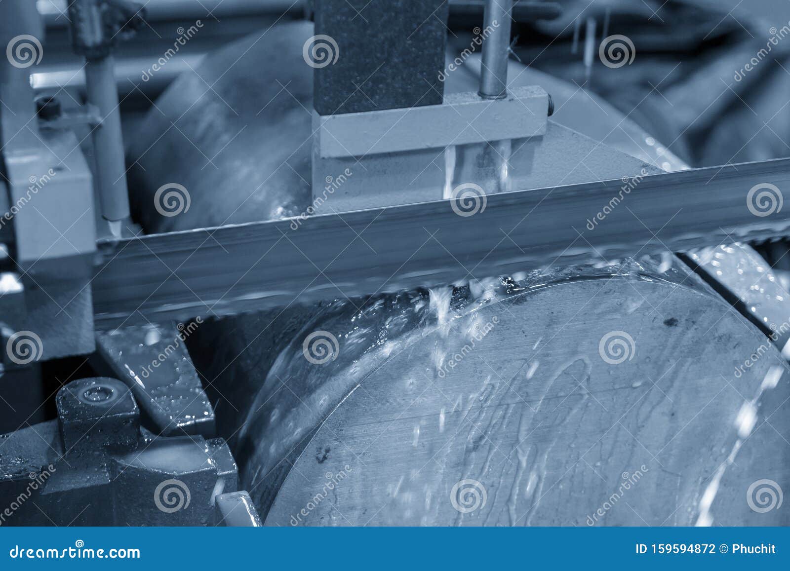 The Operation of Band Saw Machine Cutting the Metal Rod. Stock Photo ...