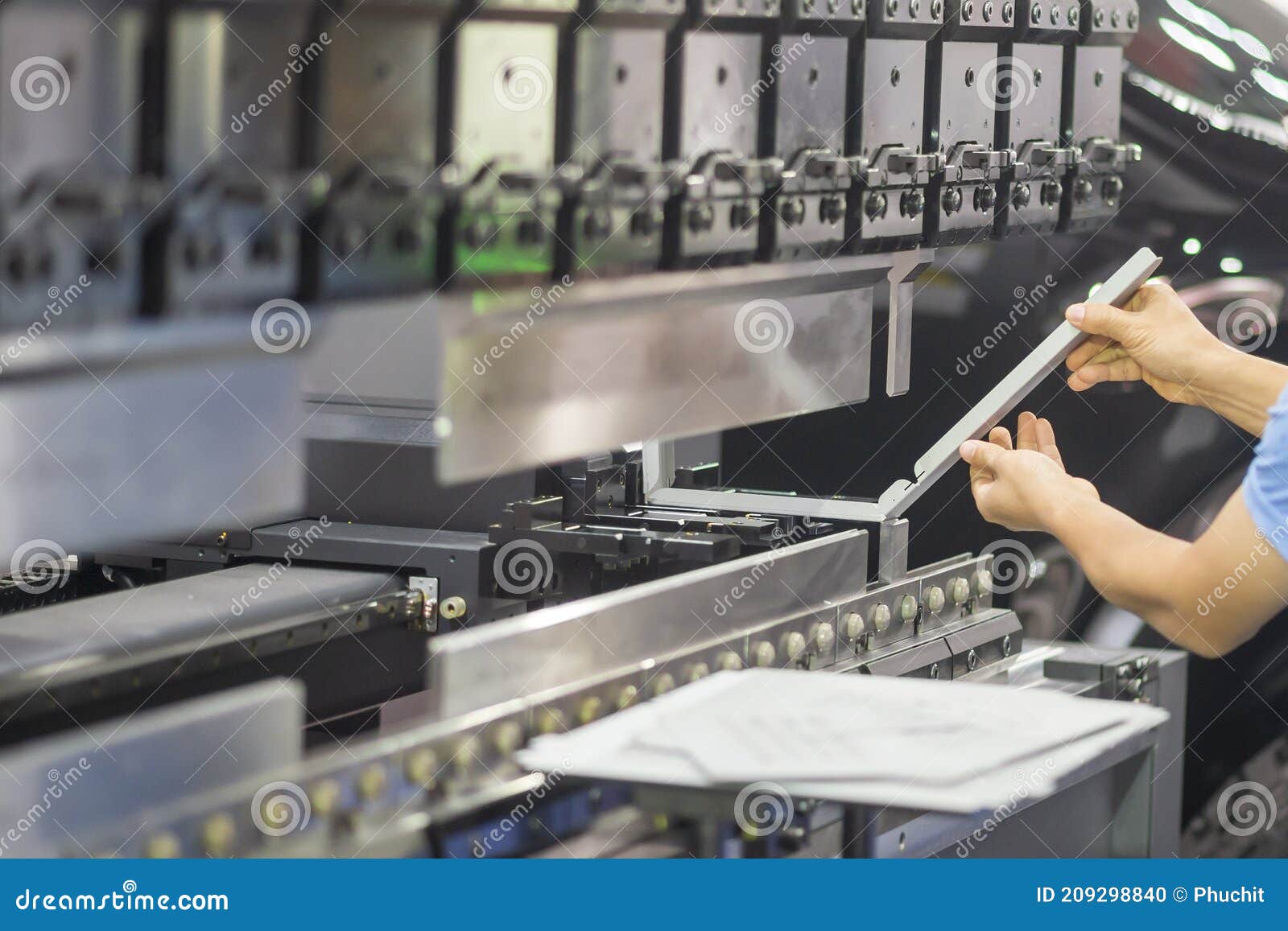 The Operation of Hydraulic Bending Machine with Technician. Stock Photo ...