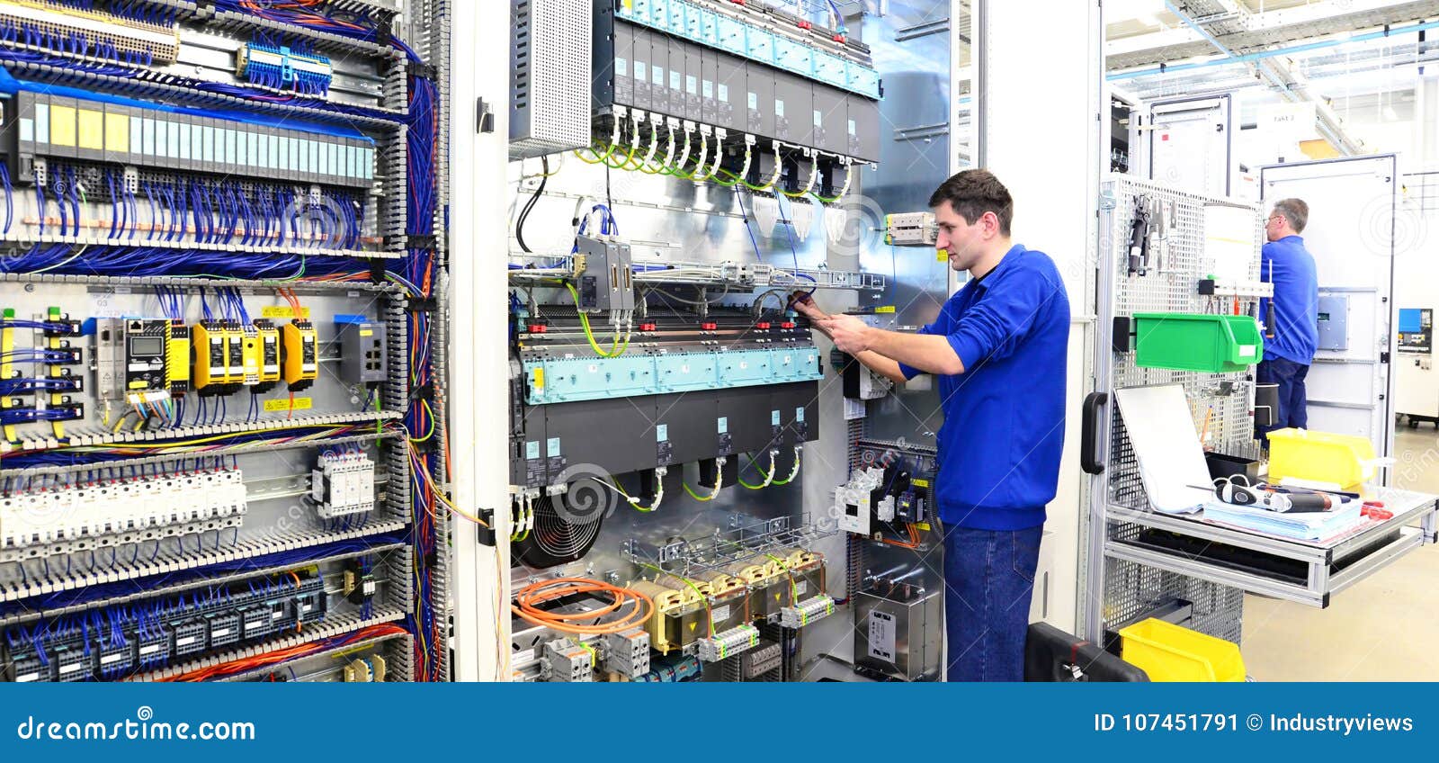 Operator Assembles Machine in a Factory - Production of Switch C Stock ...