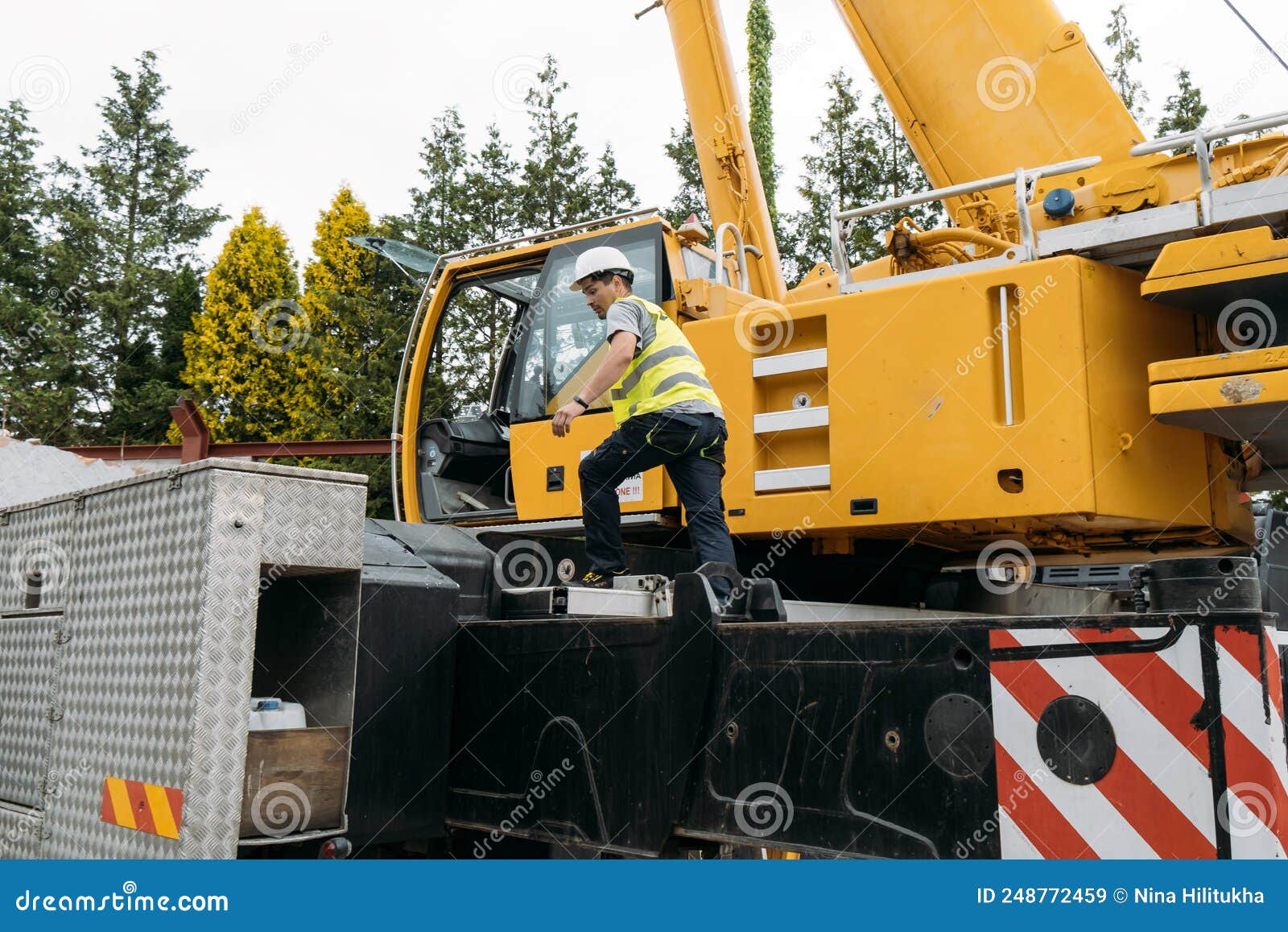 Operator Climbing on Big Building Crane on Construction Site Stock ...