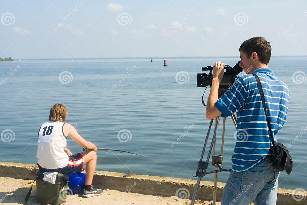 Operator and fisherman stock image. Image of filming - 15058157