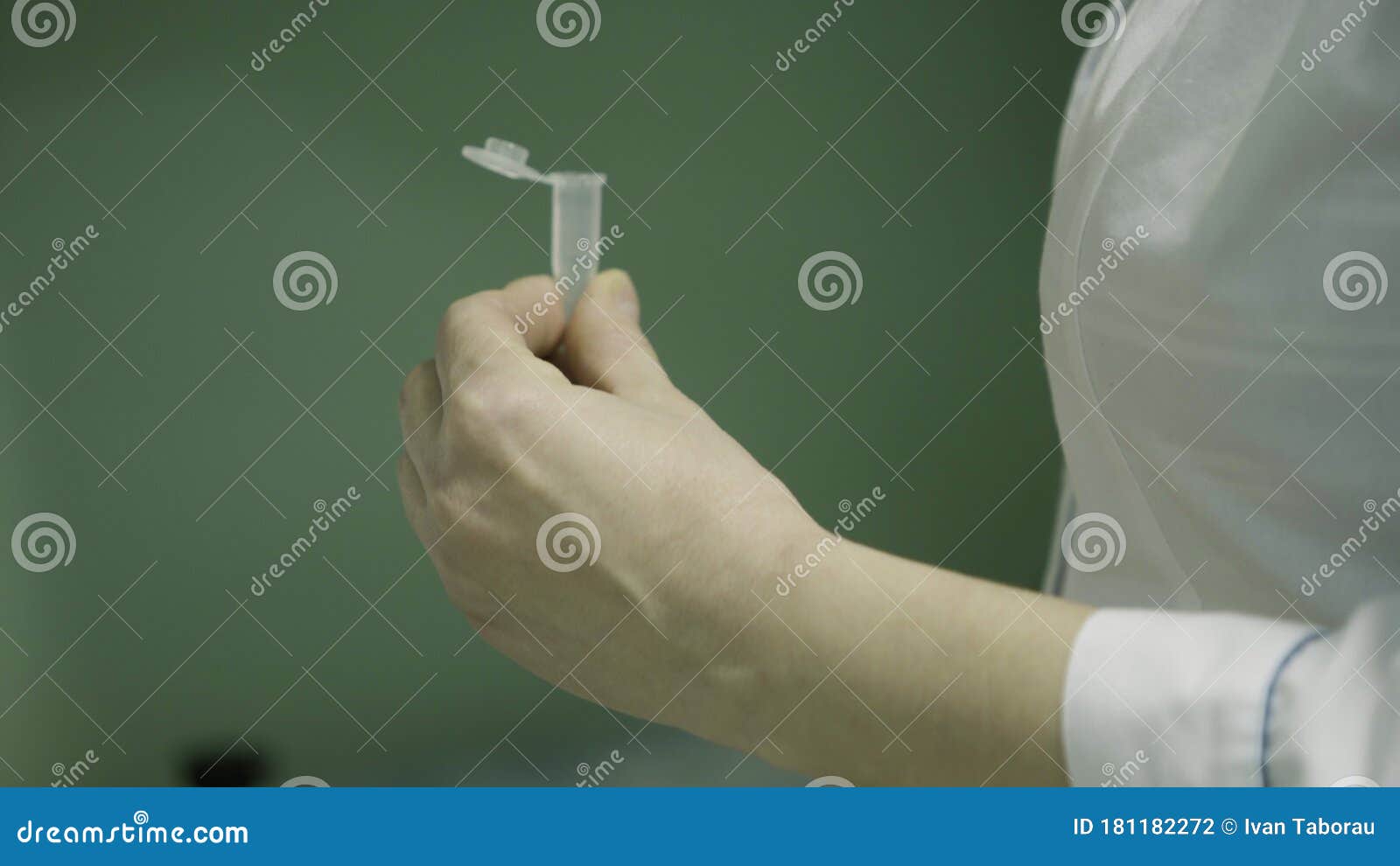 The Operator Measuring a Sample of Water or Solution in a Chemical ...