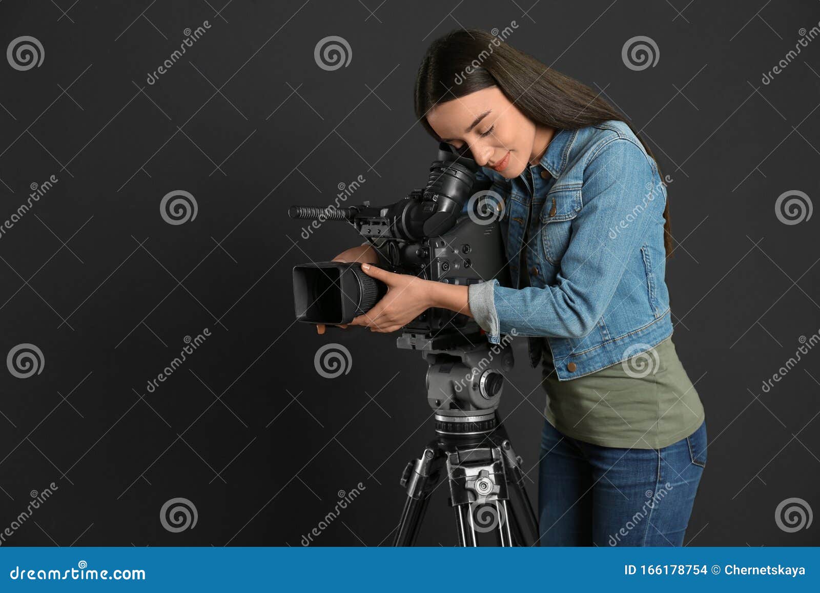 Operator with Professional Video Camera on Black Background Stock Photo ...