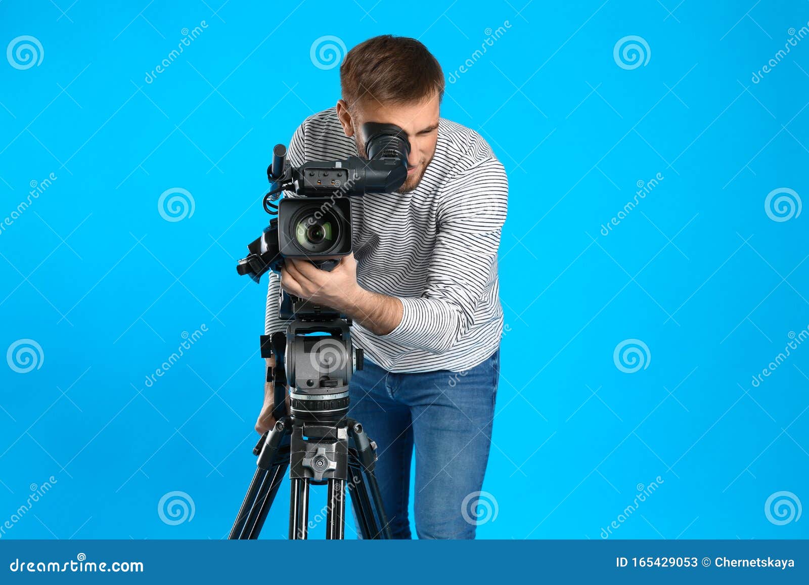 Operator with Professional Video Camera on Blue Background Stock Image ...
