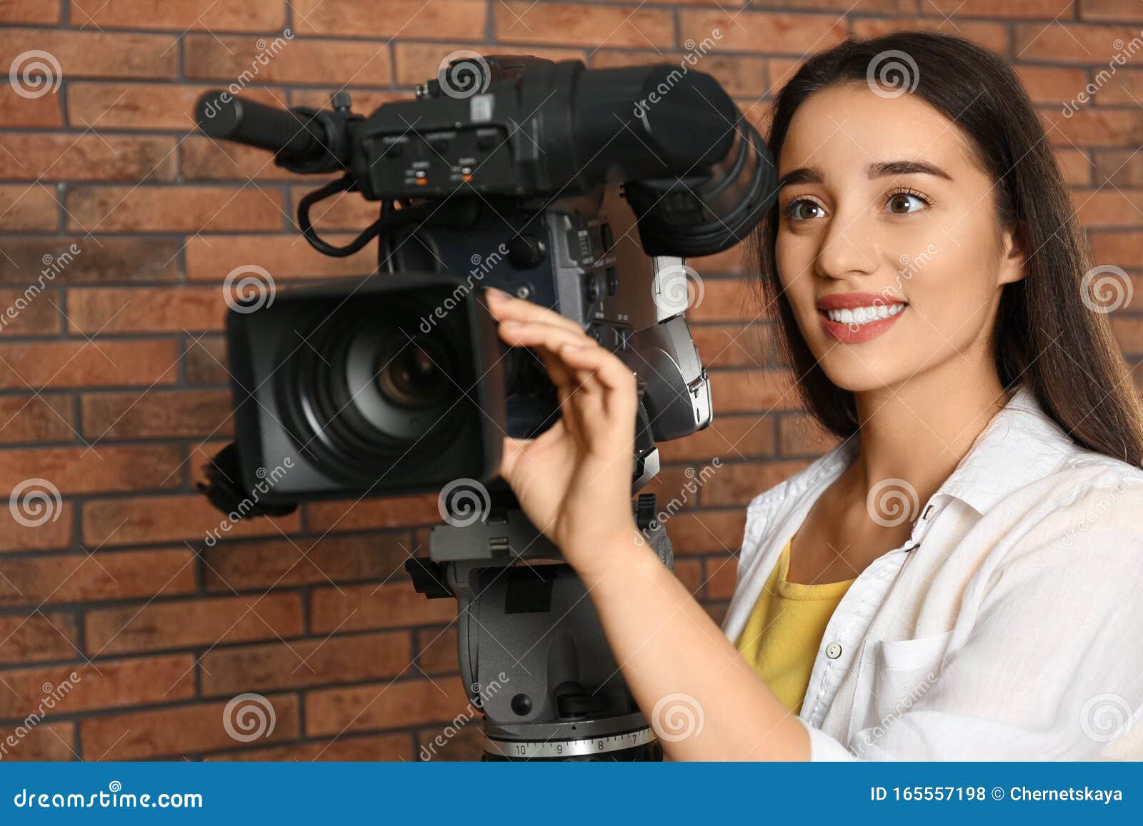 Operator with Professional Video Camera Near Wall Stock Photo - Image ...