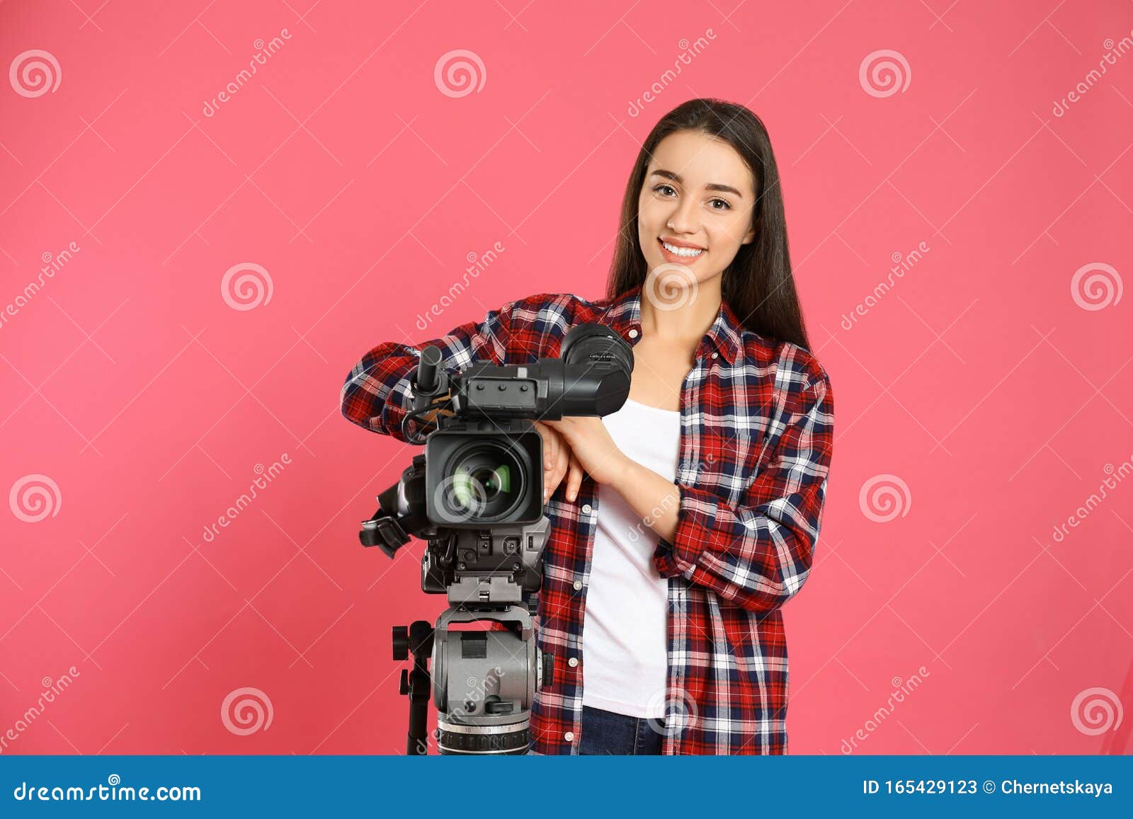 Operator with Professional Video Camera on Pink Background Stock Image ...
