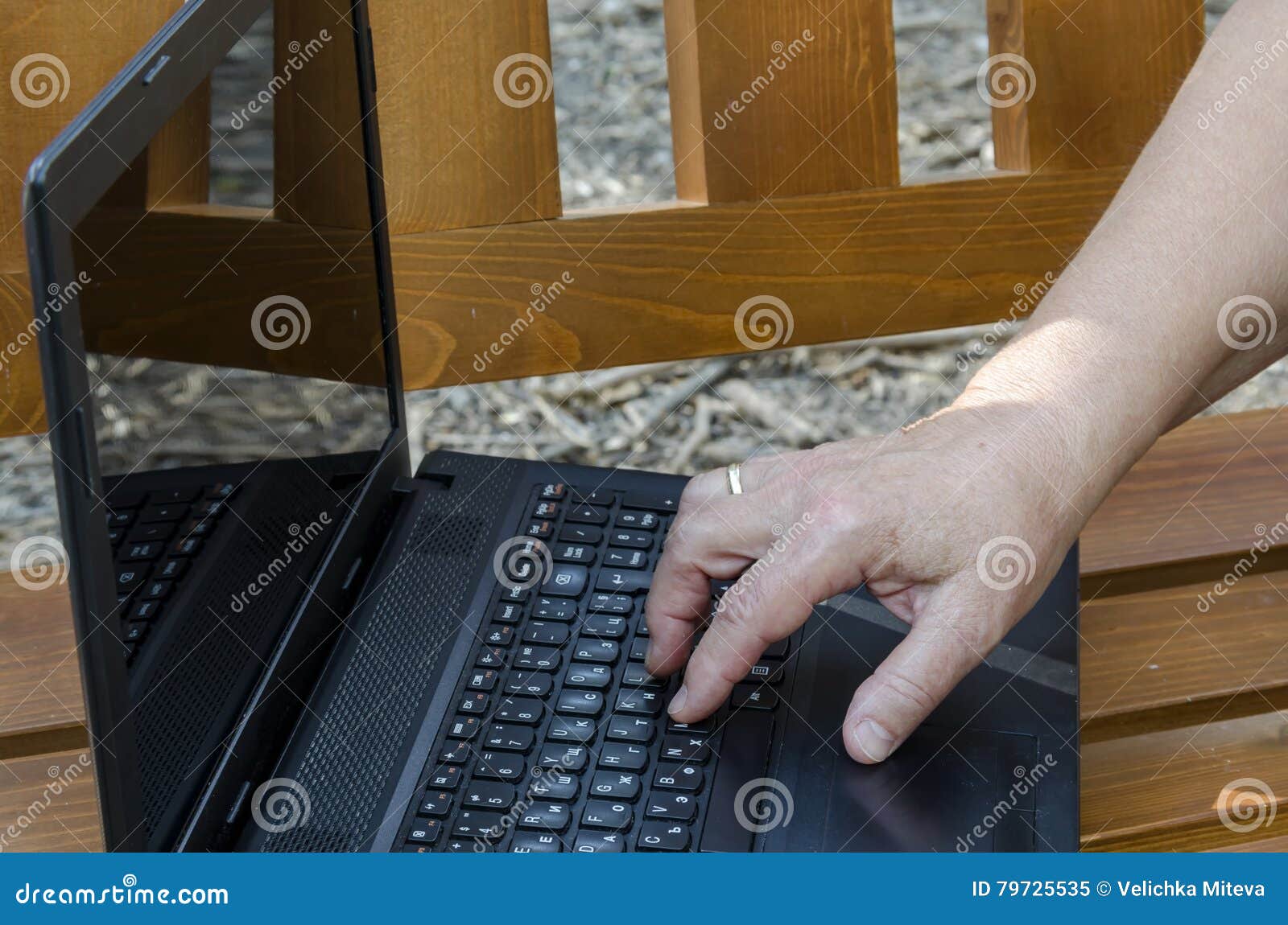 Operator Work on Open Laptop Computer on a Wooden Bench Stock Image ...