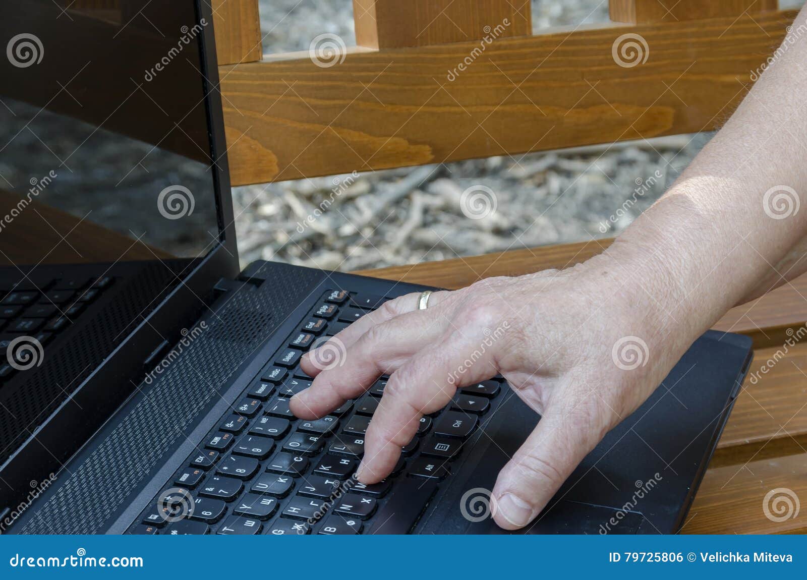Operator Work on Open Laptop Computer on a Wooden Bench Stock Photo ...