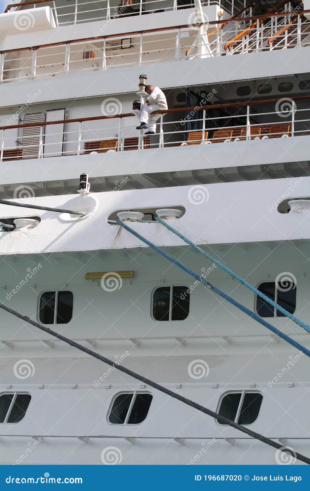 Operator Working on the Railing of the Cruise Liner at High Altitude ...