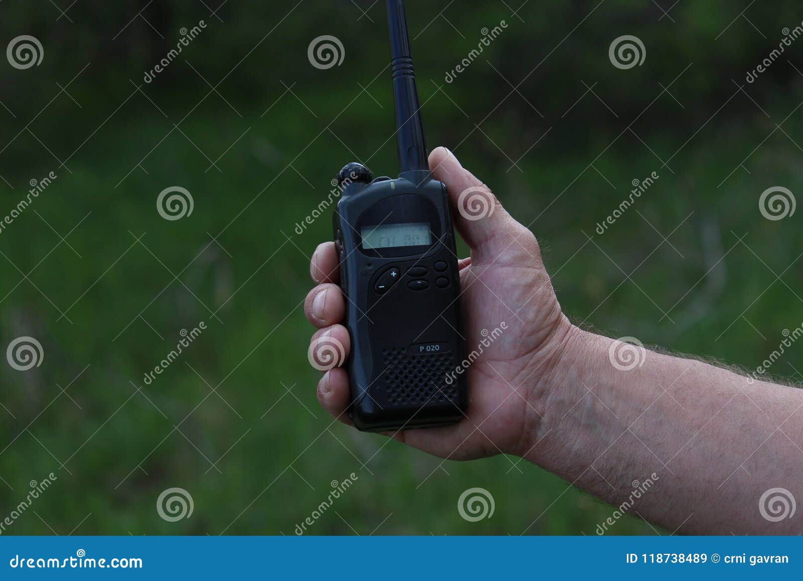 The Operator at the Workplace Allocates Workers with a Walkie-talkie ...